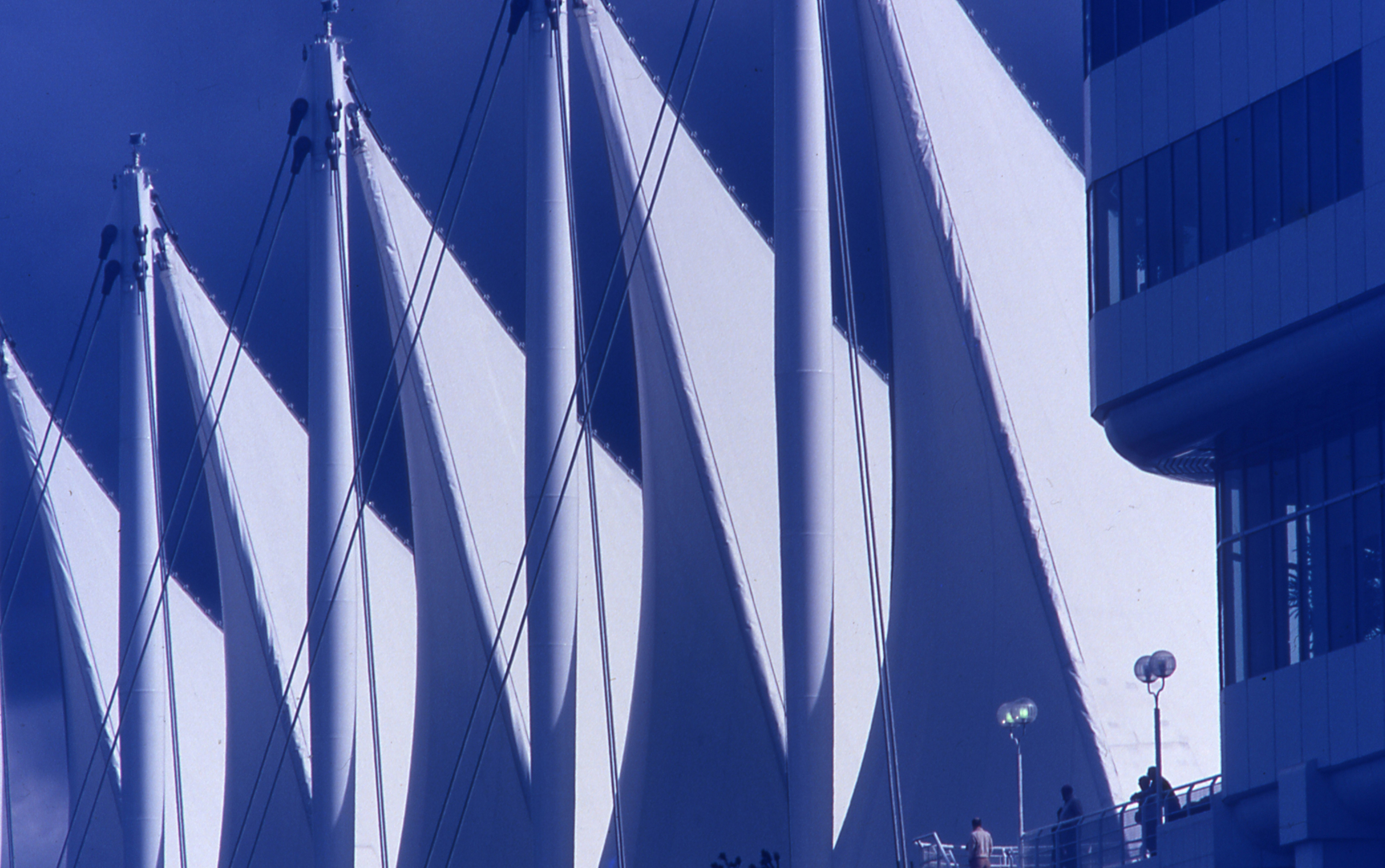 A tall building with white sails on the side of it photo – Free Canada ...