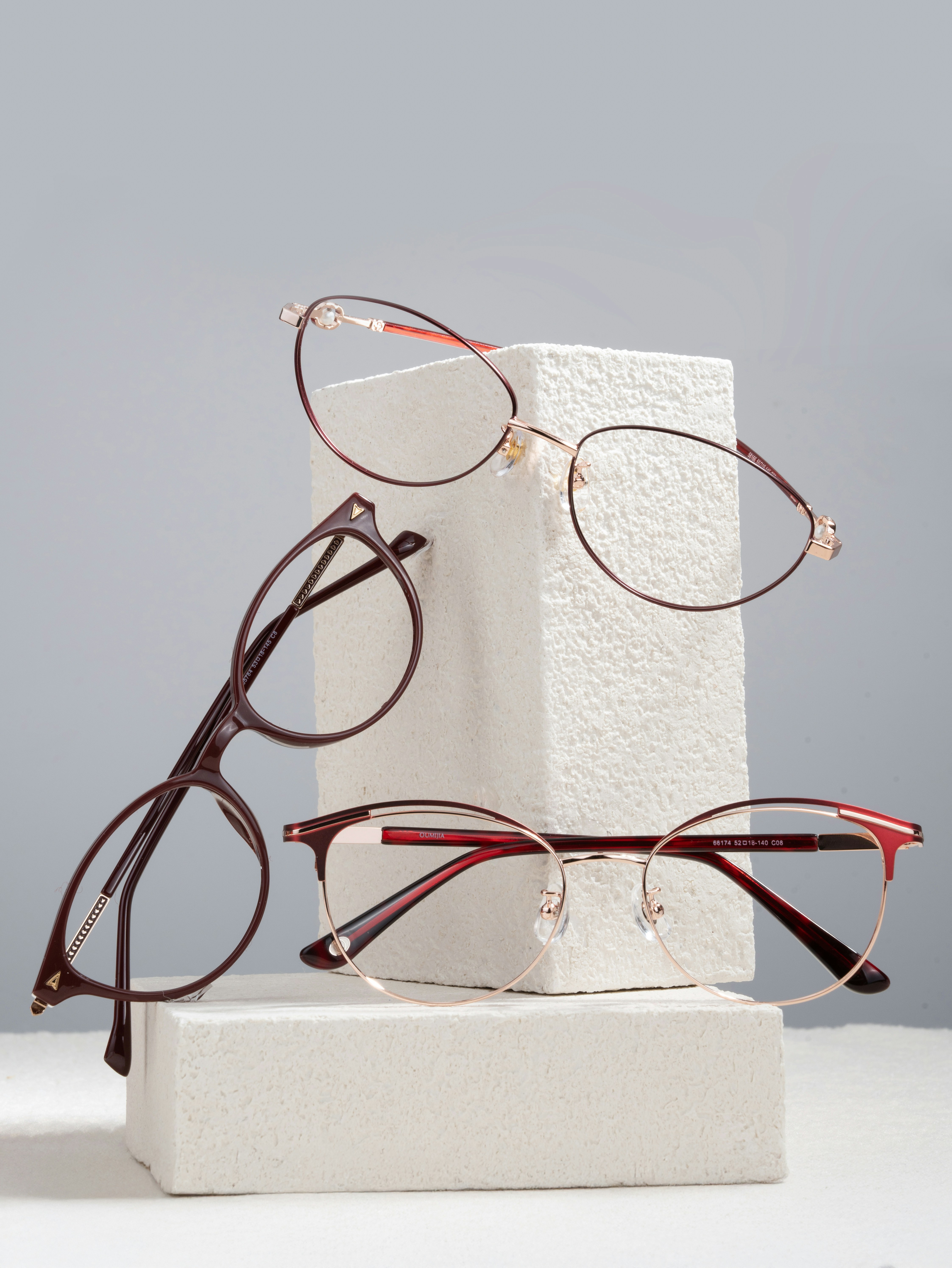A stack of glasses sitting on top of a white block photo – Free ...