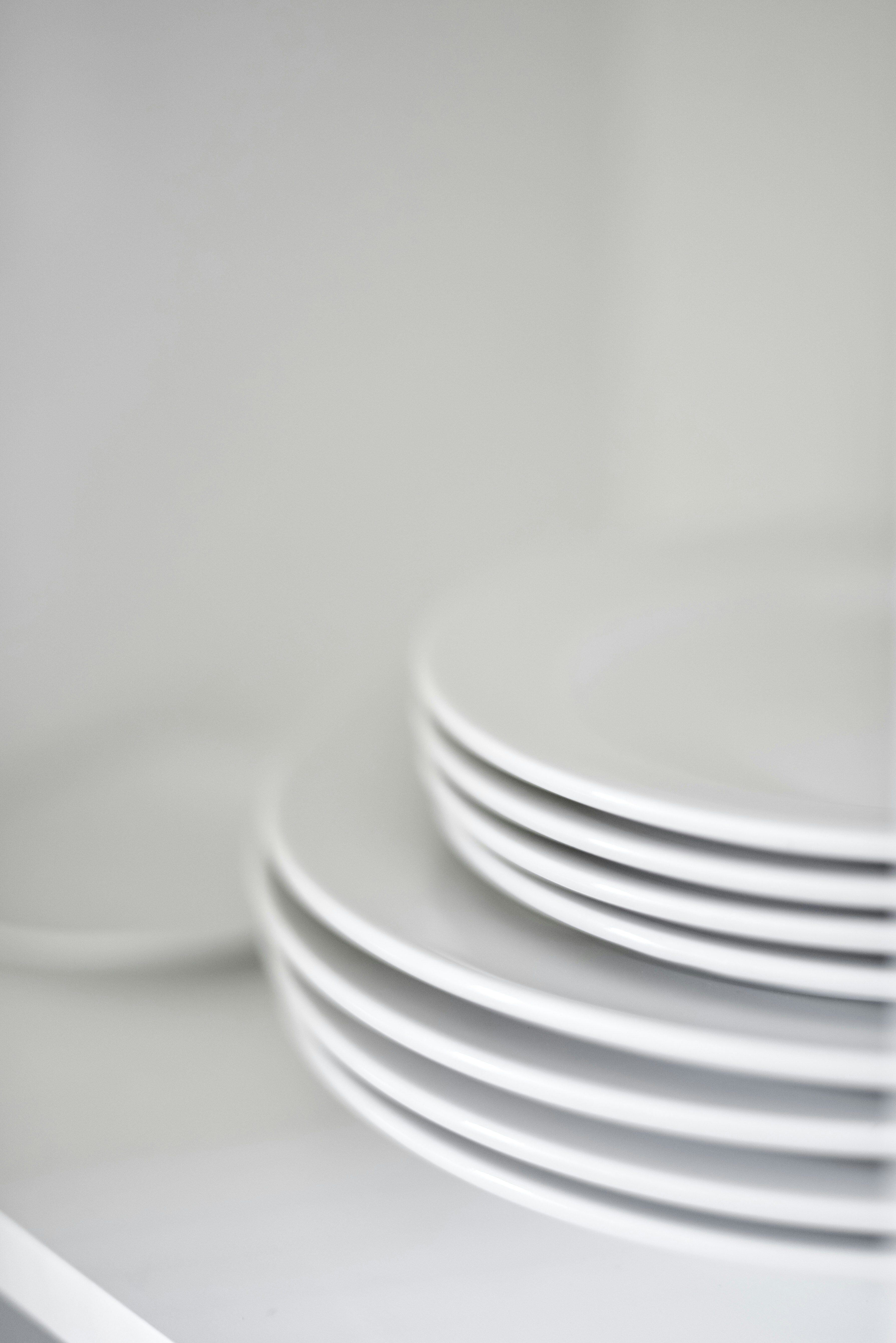 A stack of white plates stacked on top of each other photo – Free Photo ...