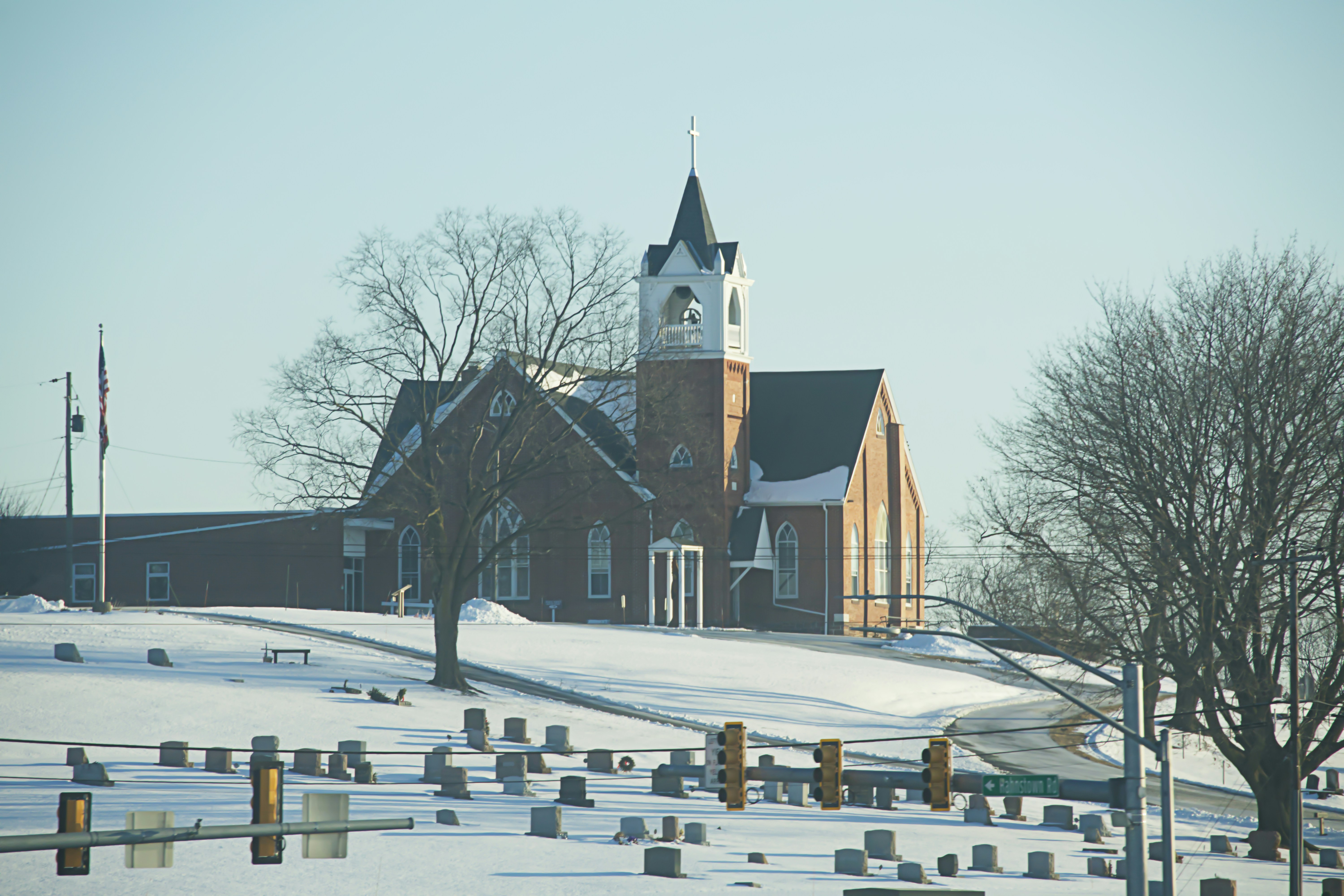 Winter Wake: A Snow-Covered Church Reaches Toward a Pale Sky