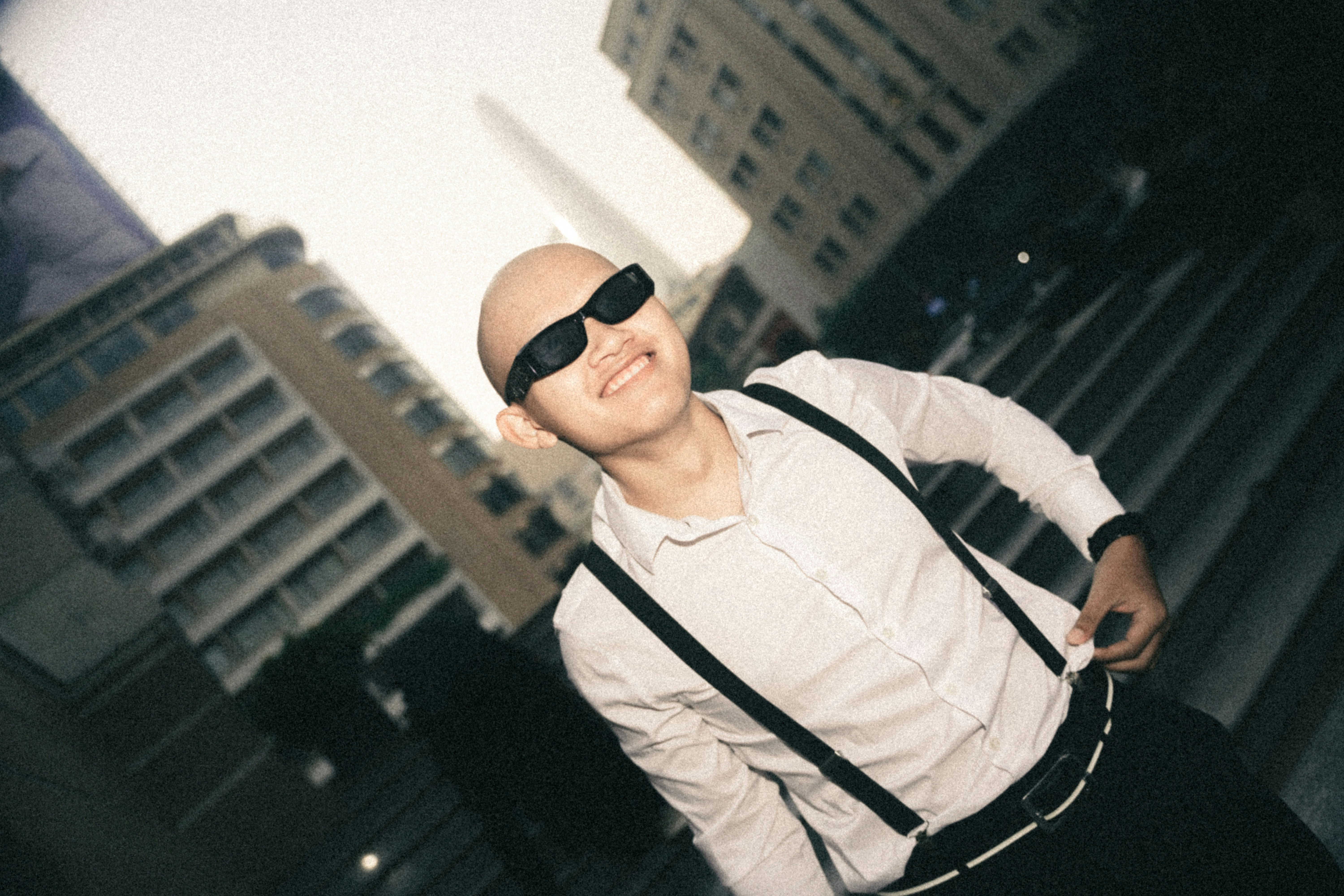 Dapper in a Concrete Canyon: A Portrait Amid Urban Geometry