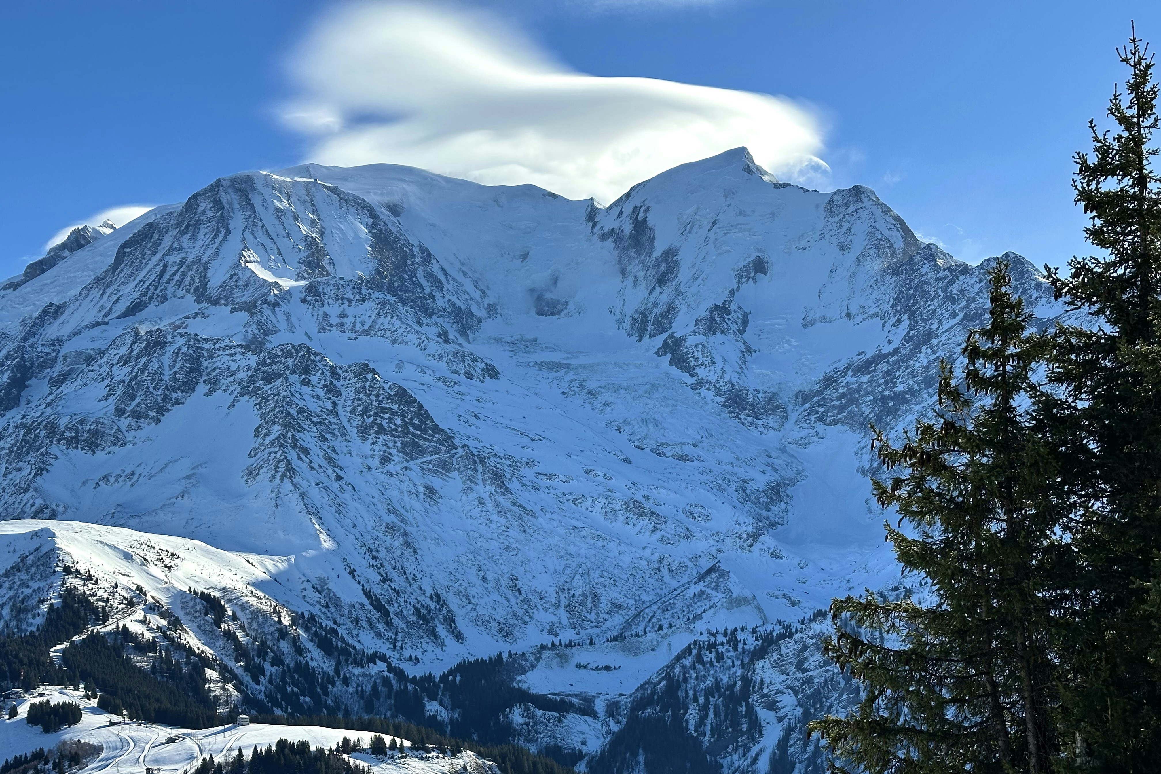 Whispering Cloud Over a Snowbound Alpine Peak