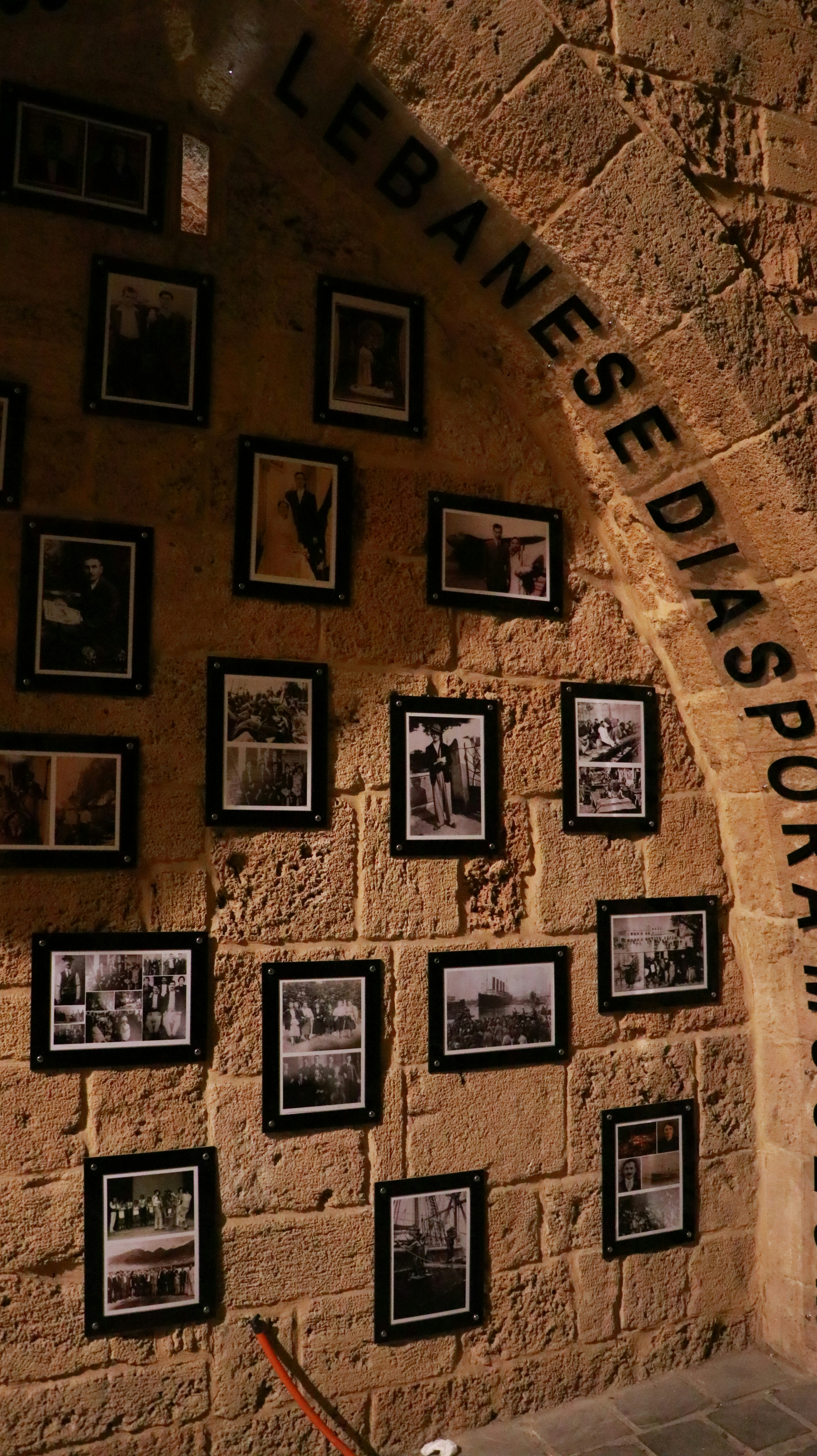 A wall with a bunch of pictures on it photo – Free Batroun old souk ...