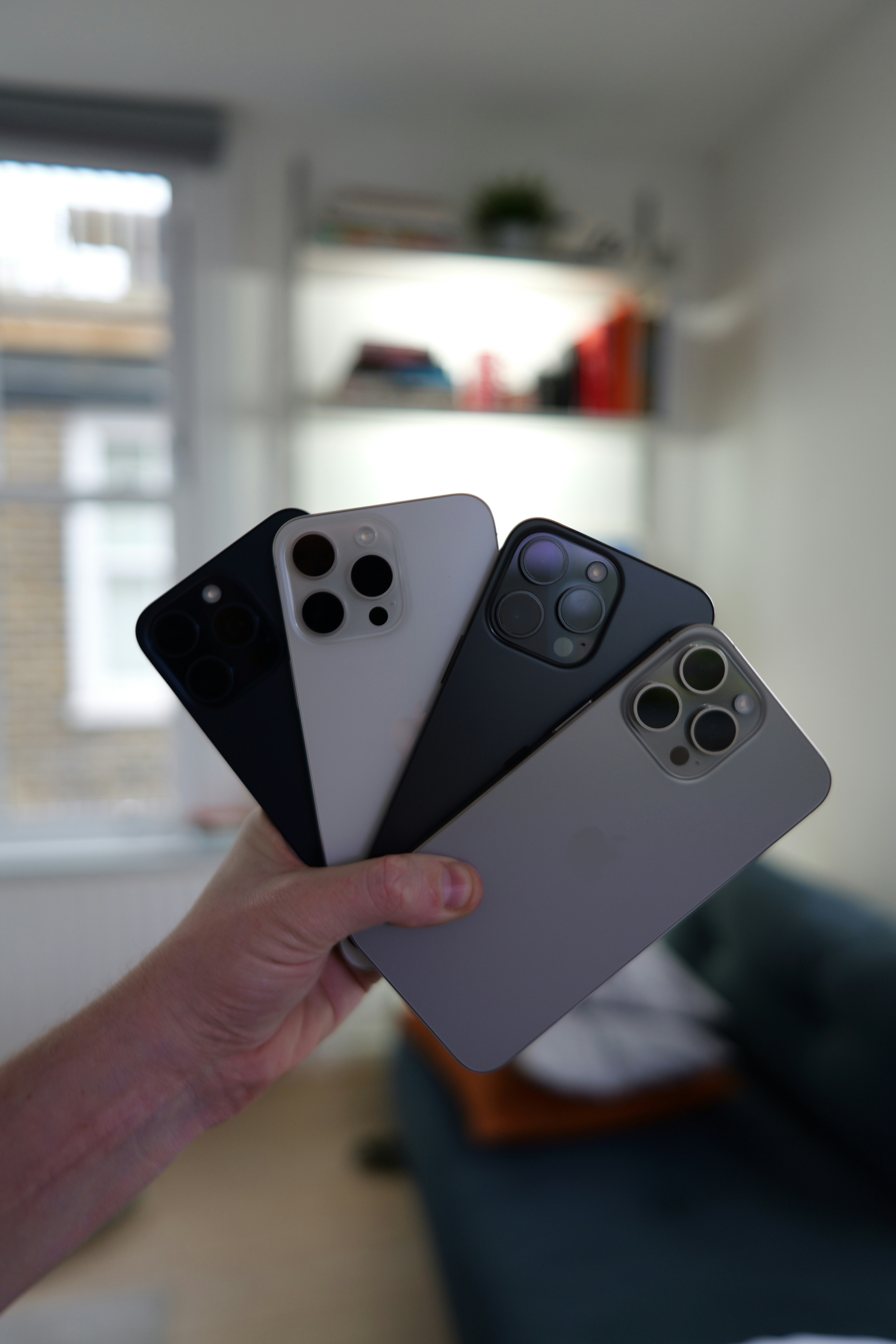 A person holding three cell phones in their hands photo – Free ...