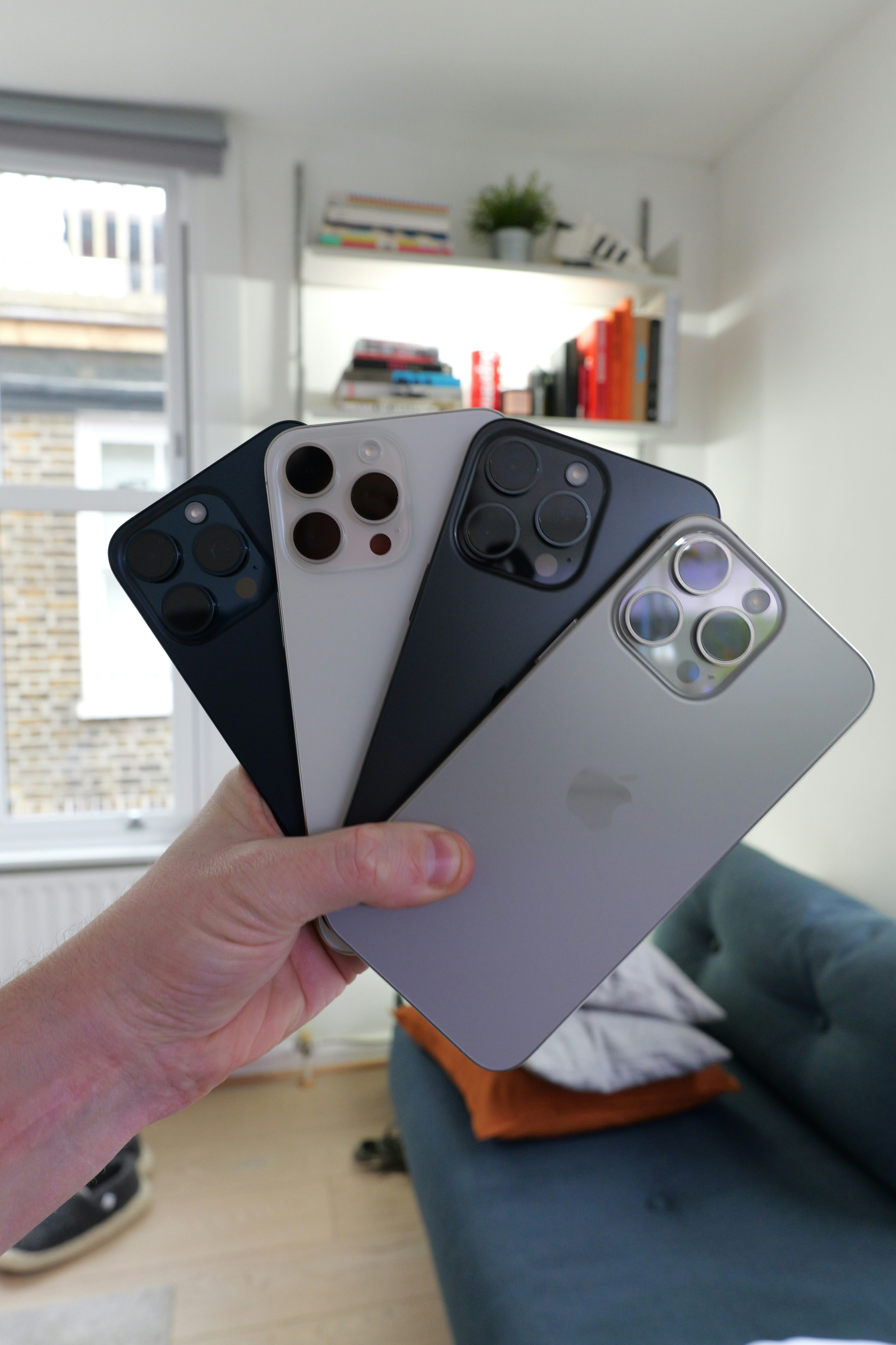 A person holding four iphones in their hands photo – Free Phone Image ...