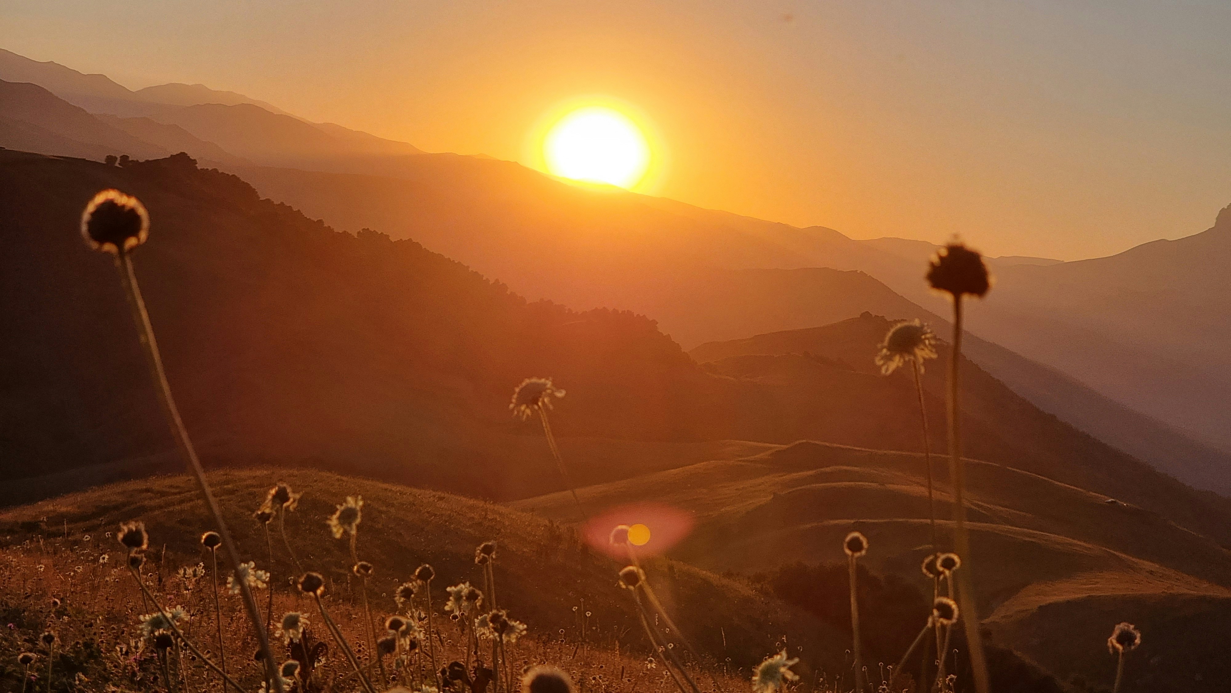 Golden Horizon Over Dune-Lined Valleys at Sunset