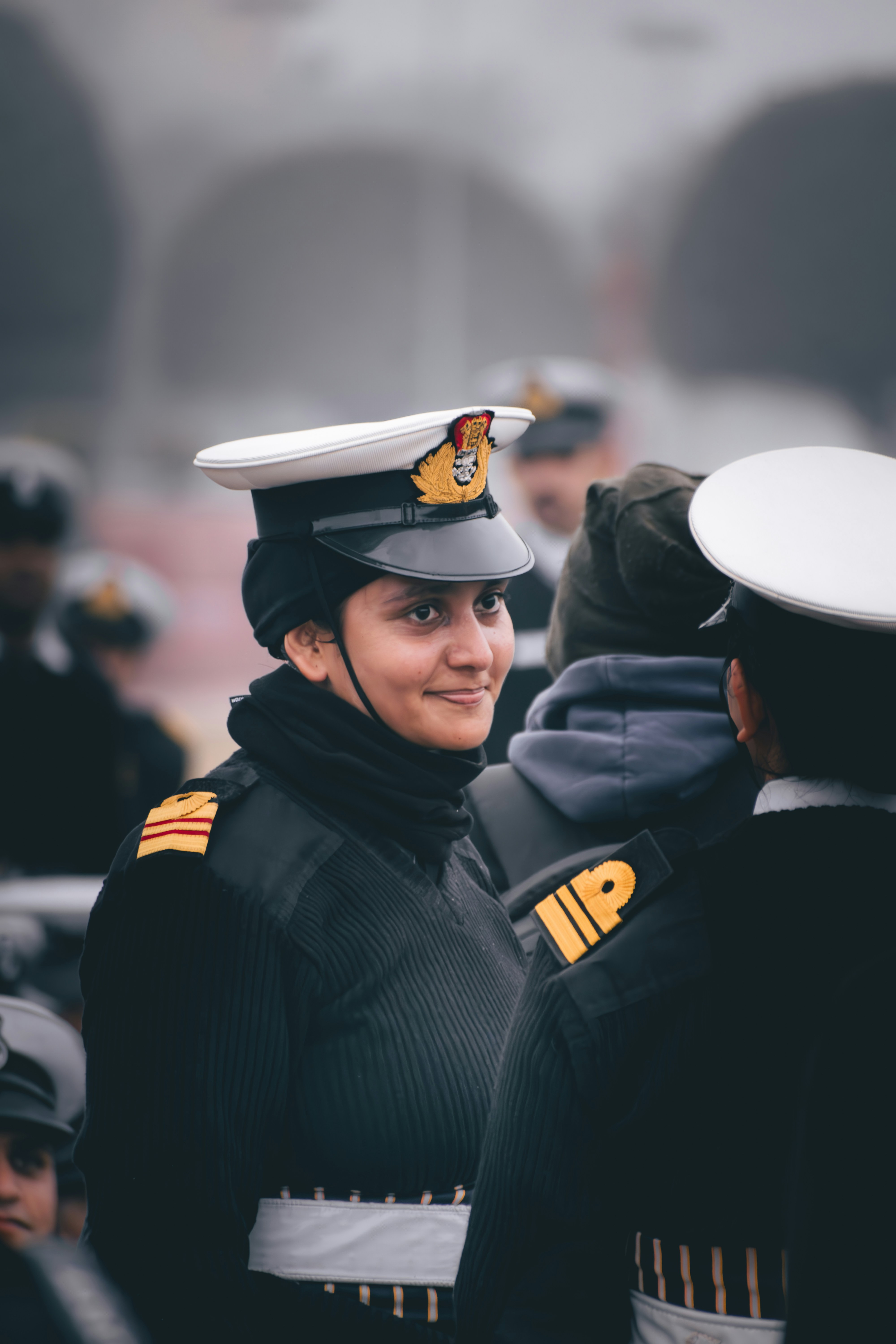 A woman in a uniform talking to a man in uniform photo – Free Woman ...