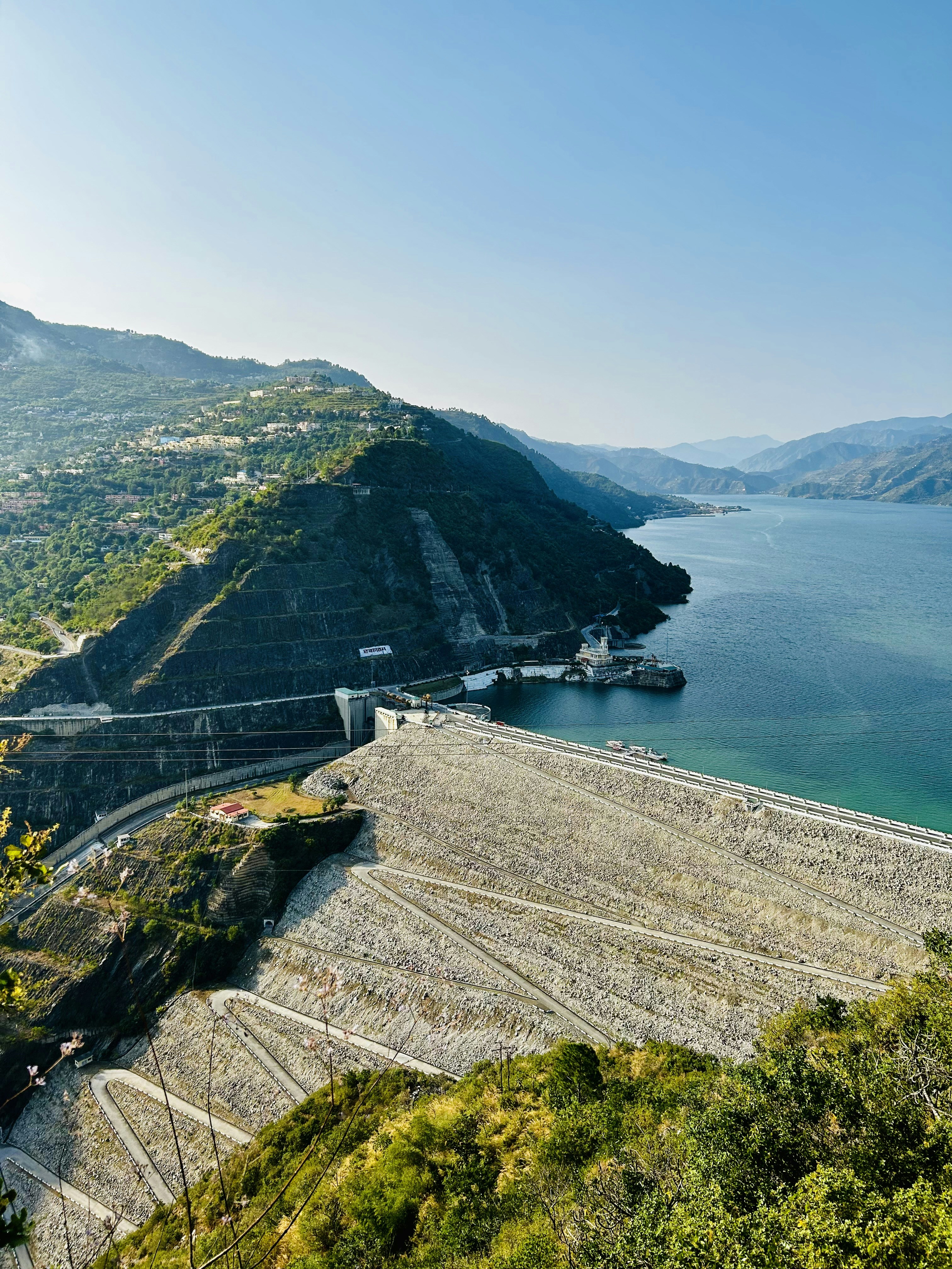 Terraced Hillside Descent Toward a Quiet Coastal Inlet