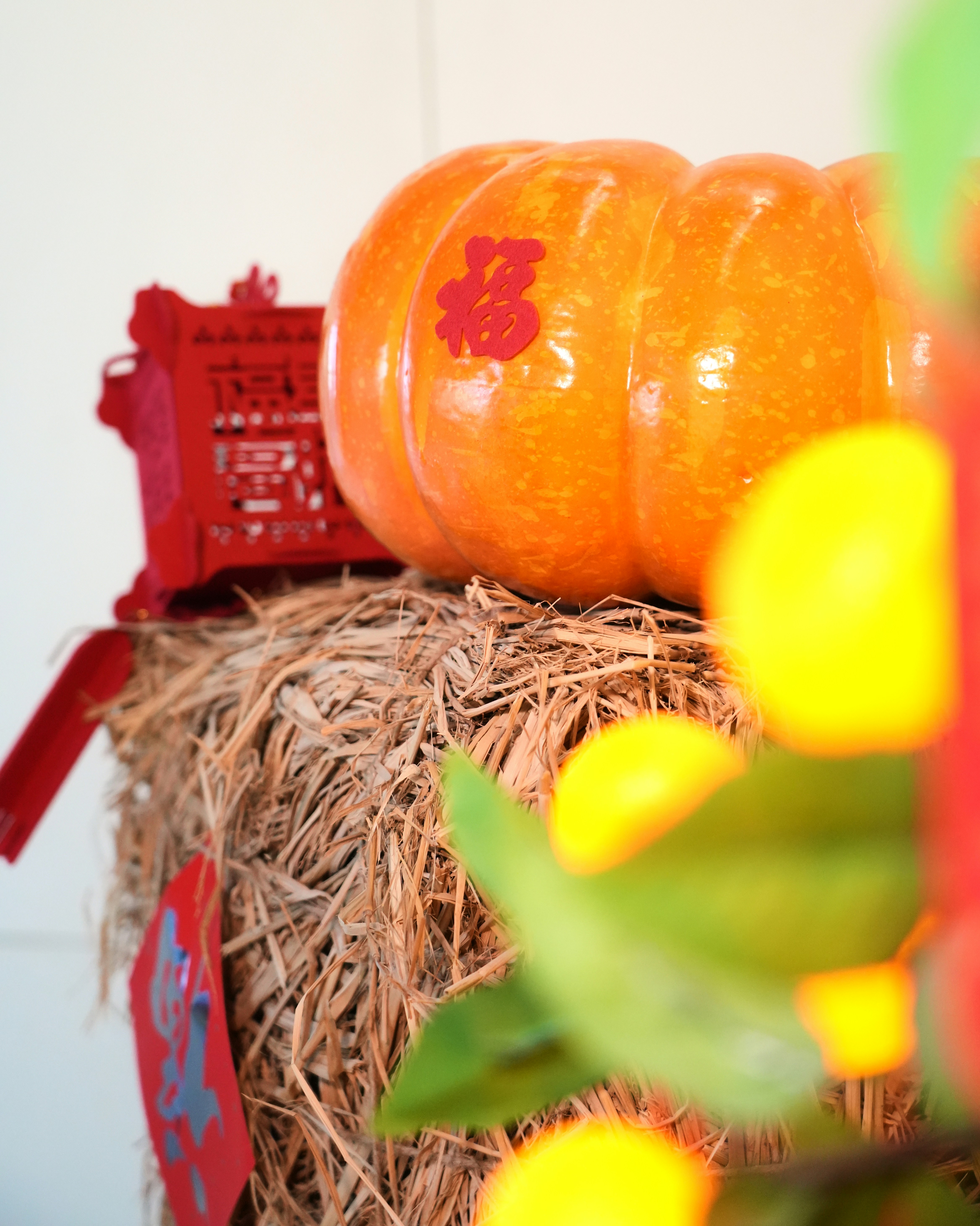 Harvest Glow: A Carved Pumpkin Resting on Rustic Hay
