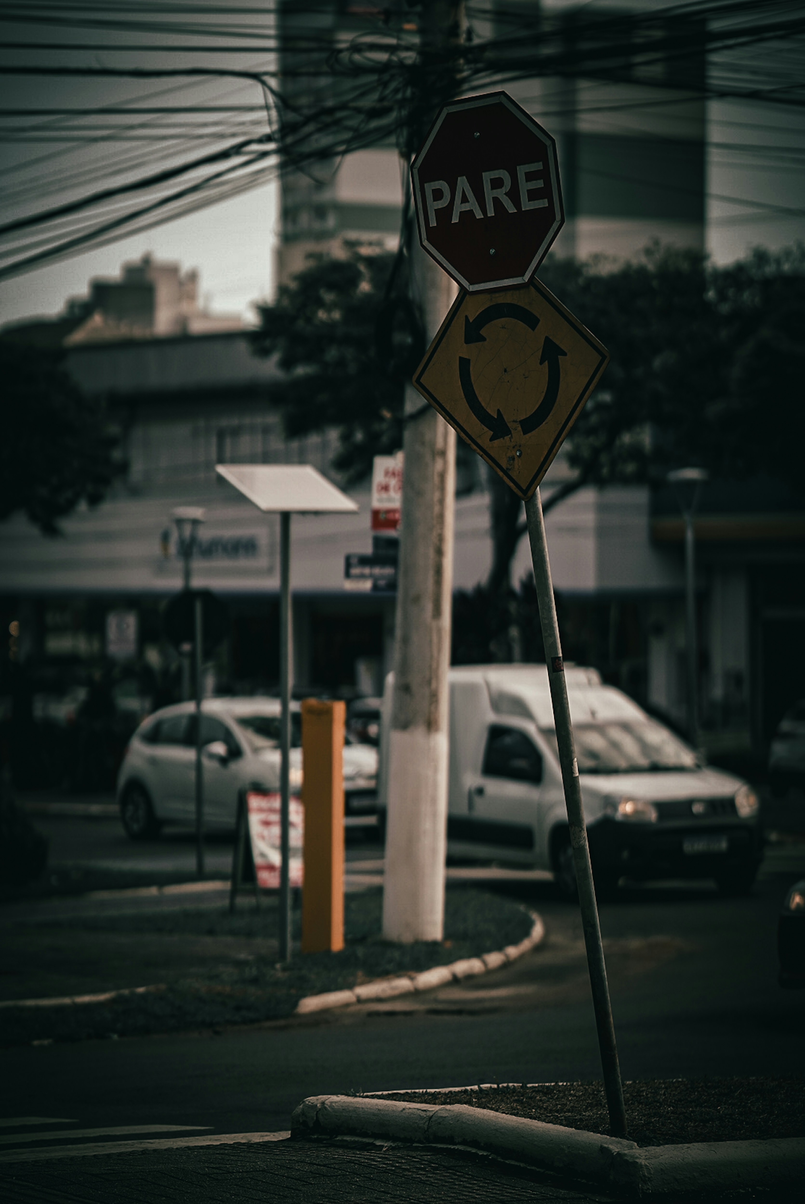A red stop sign sitting on the side of a road
