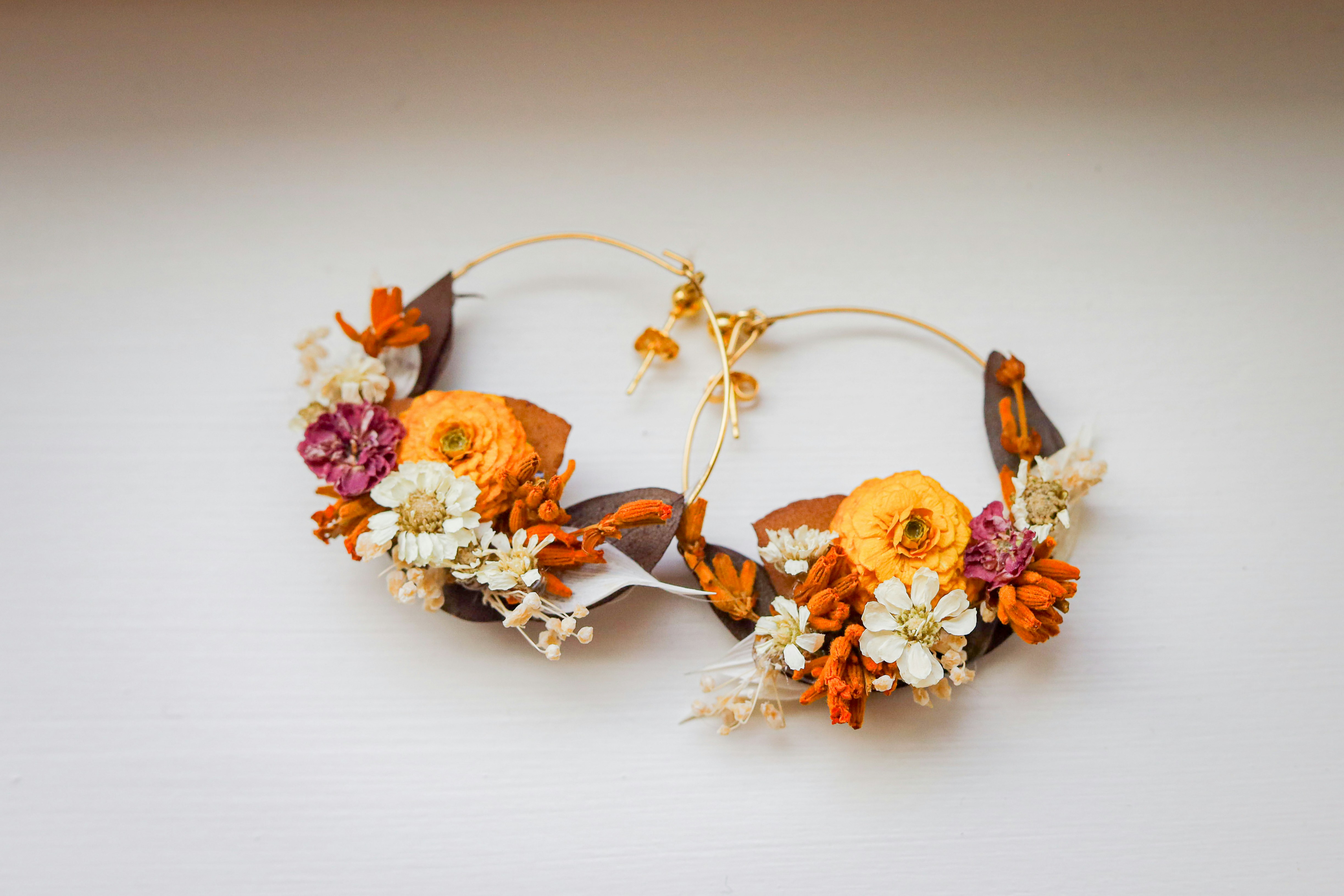 Sunlit Floral Crown: Orange and Ivory Blooms on a Delicate Band