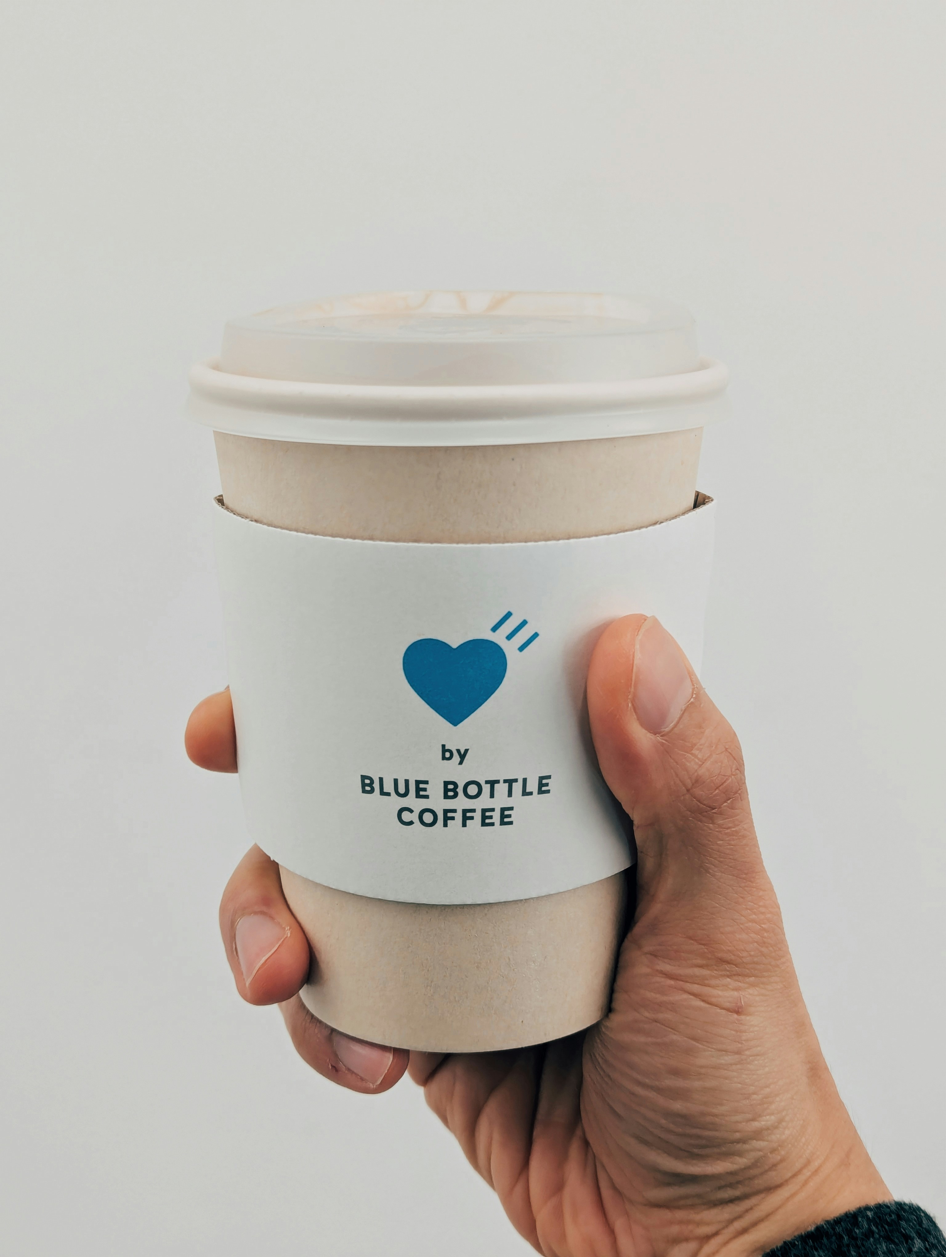 Blue Bottle Branding in Hand: A Minimal Coffee Cup Moment