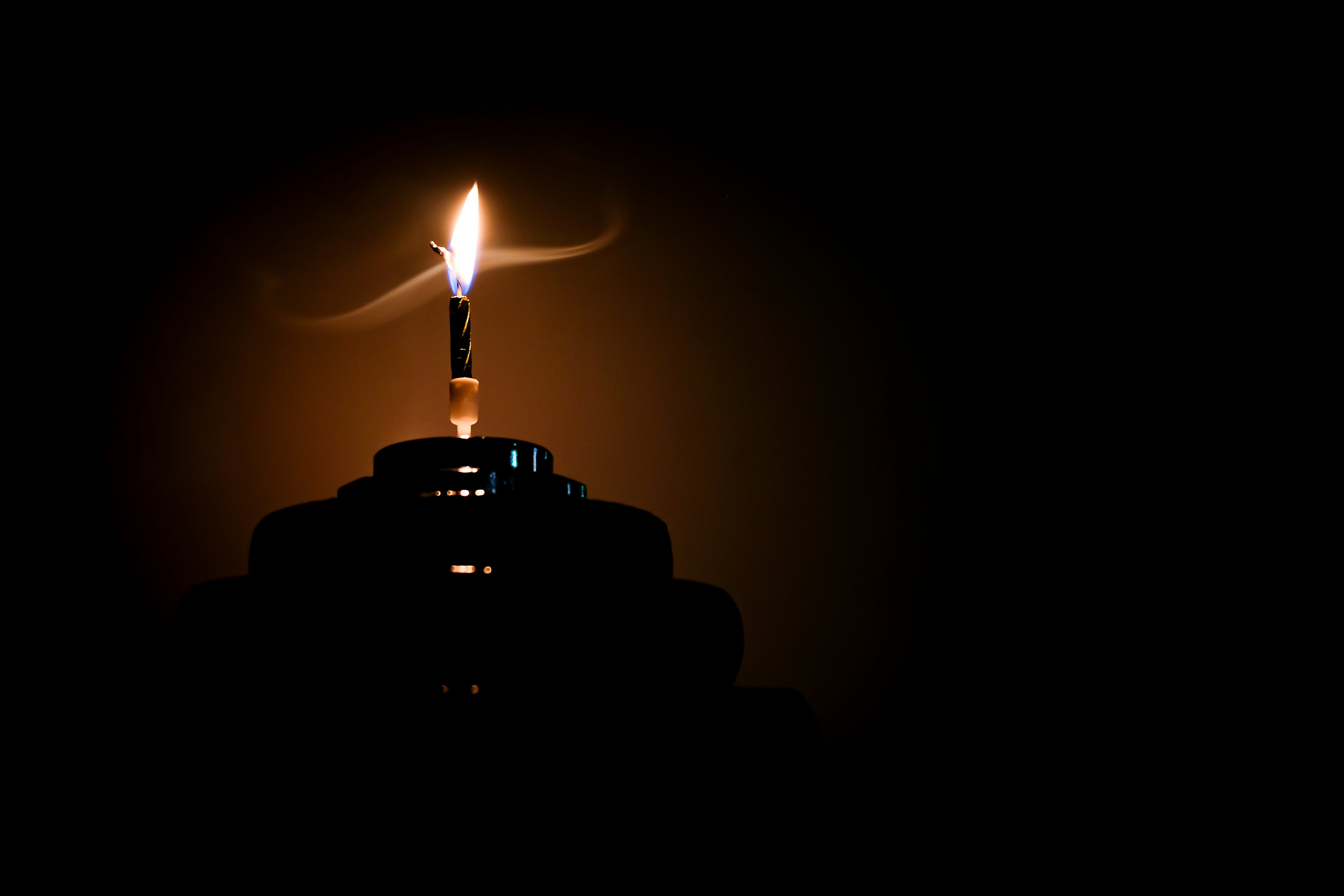 Solitary Flame in the Shadows