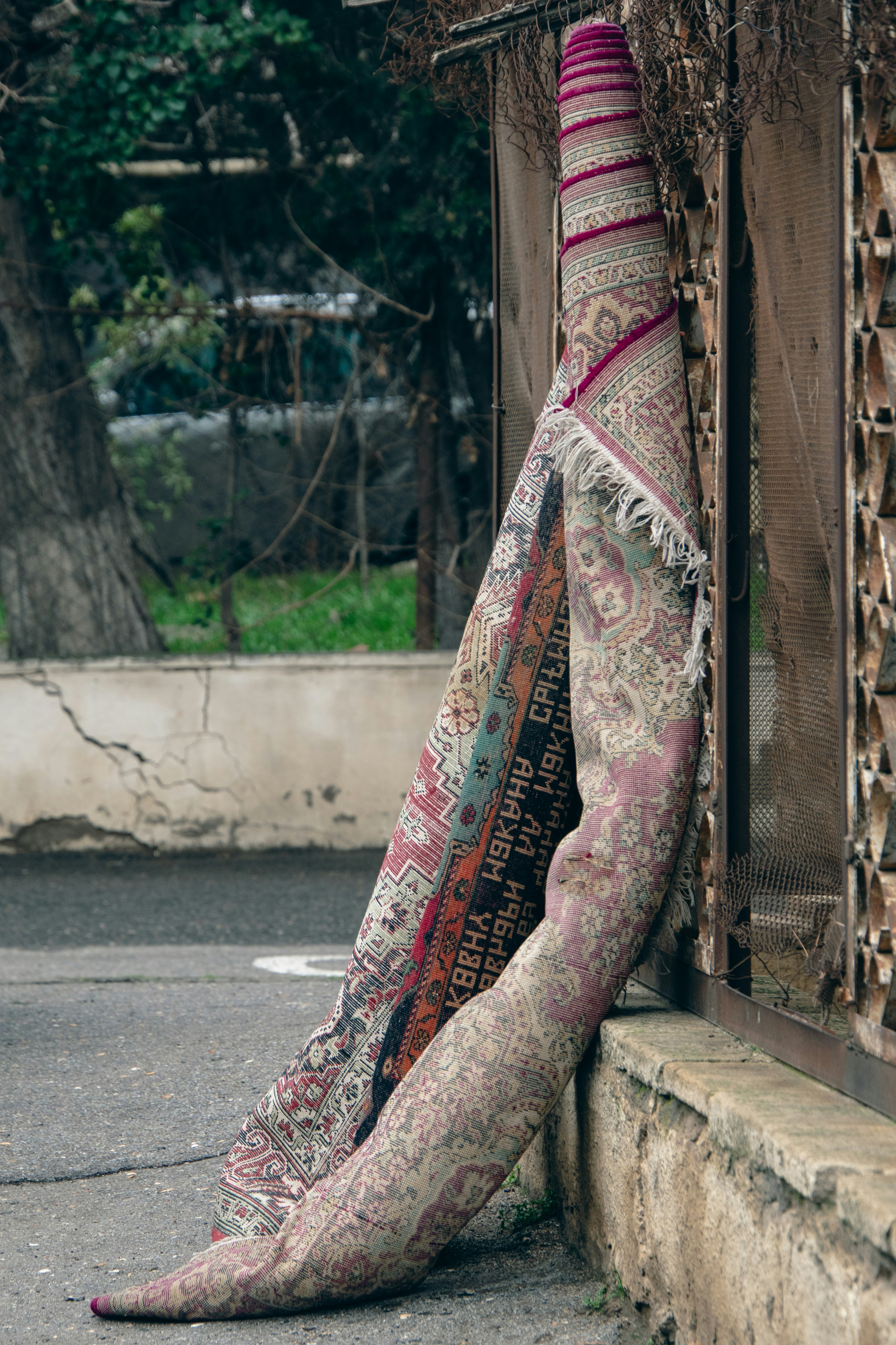 A large piece of cloth hanging from a wooden structure photo – Free ...