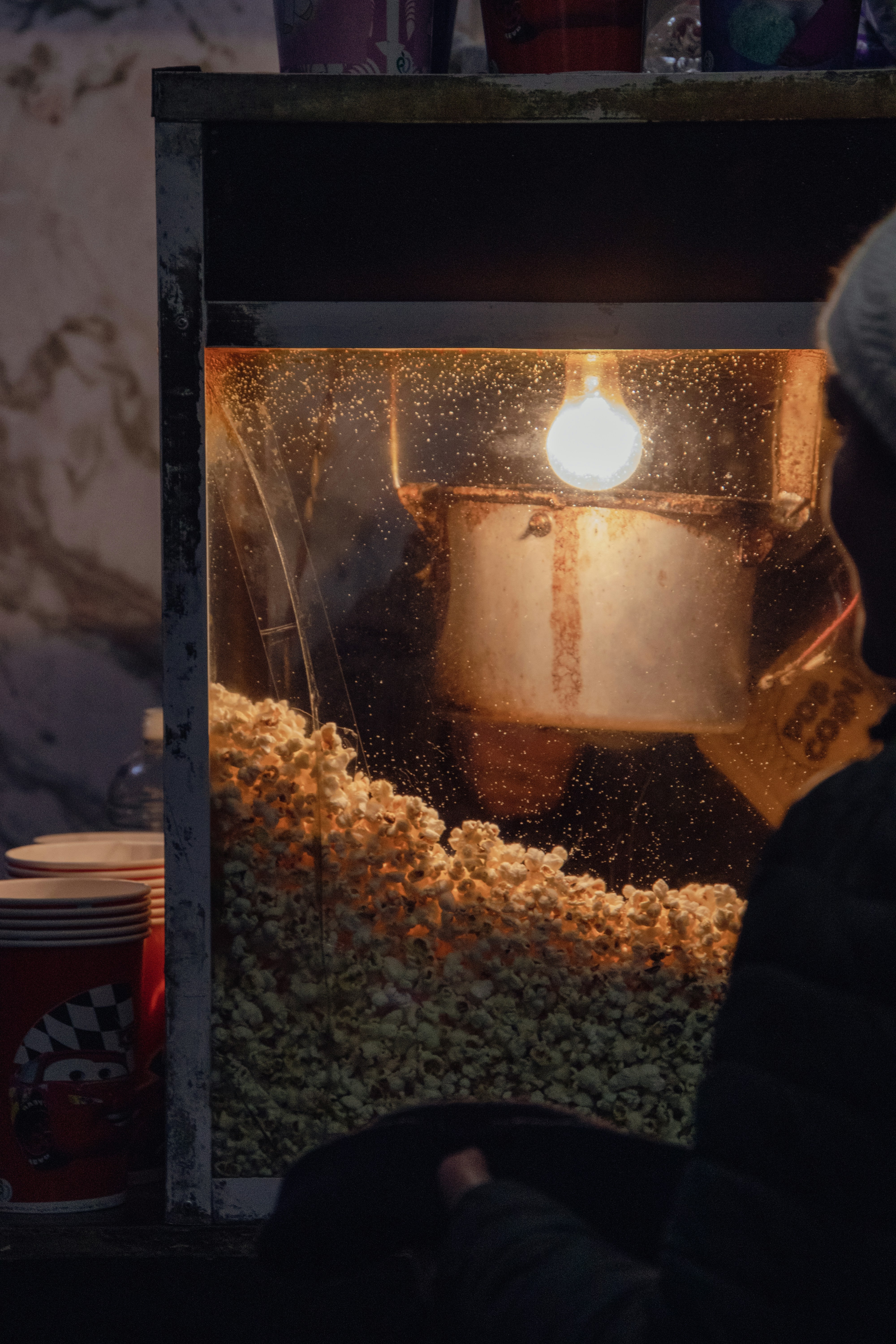 Bulb-lit Popcorn Window: A Night Market Snack Stand Glows Behind Glass