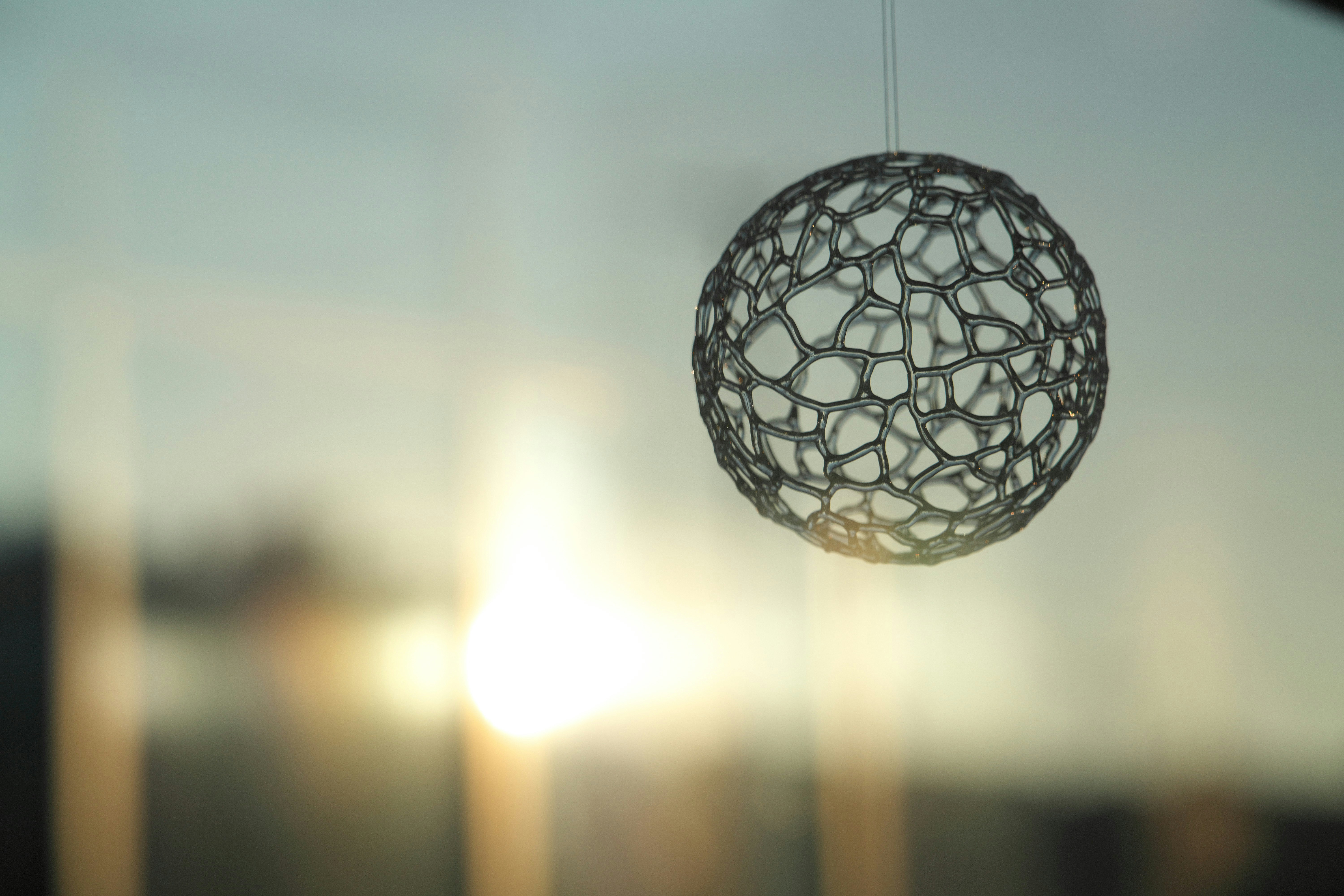 Sun-kissed Lattice Sphere Suspended in Quiet Backlight
