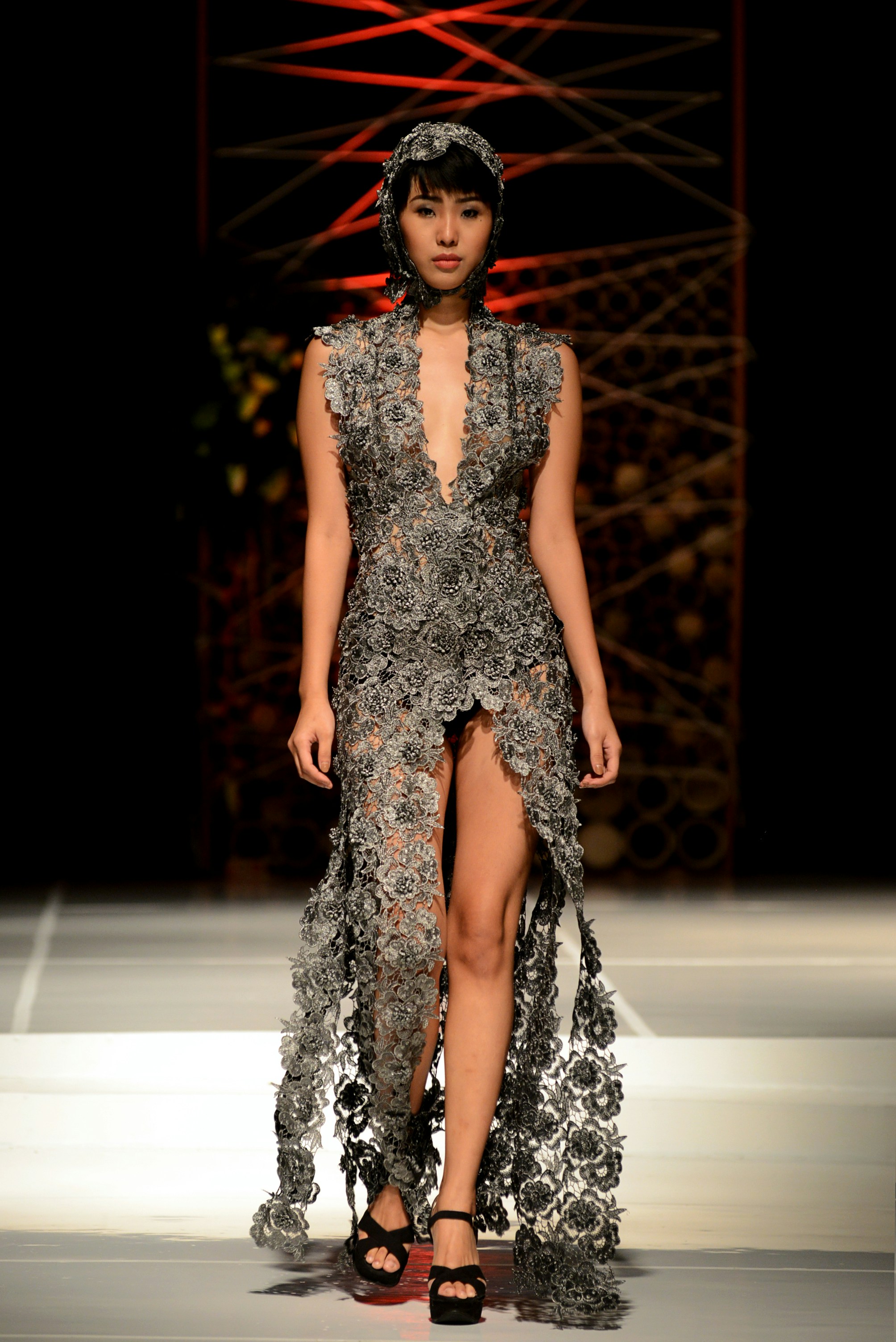 Embellished Veil: A Gown of Lace and Light on the Runway