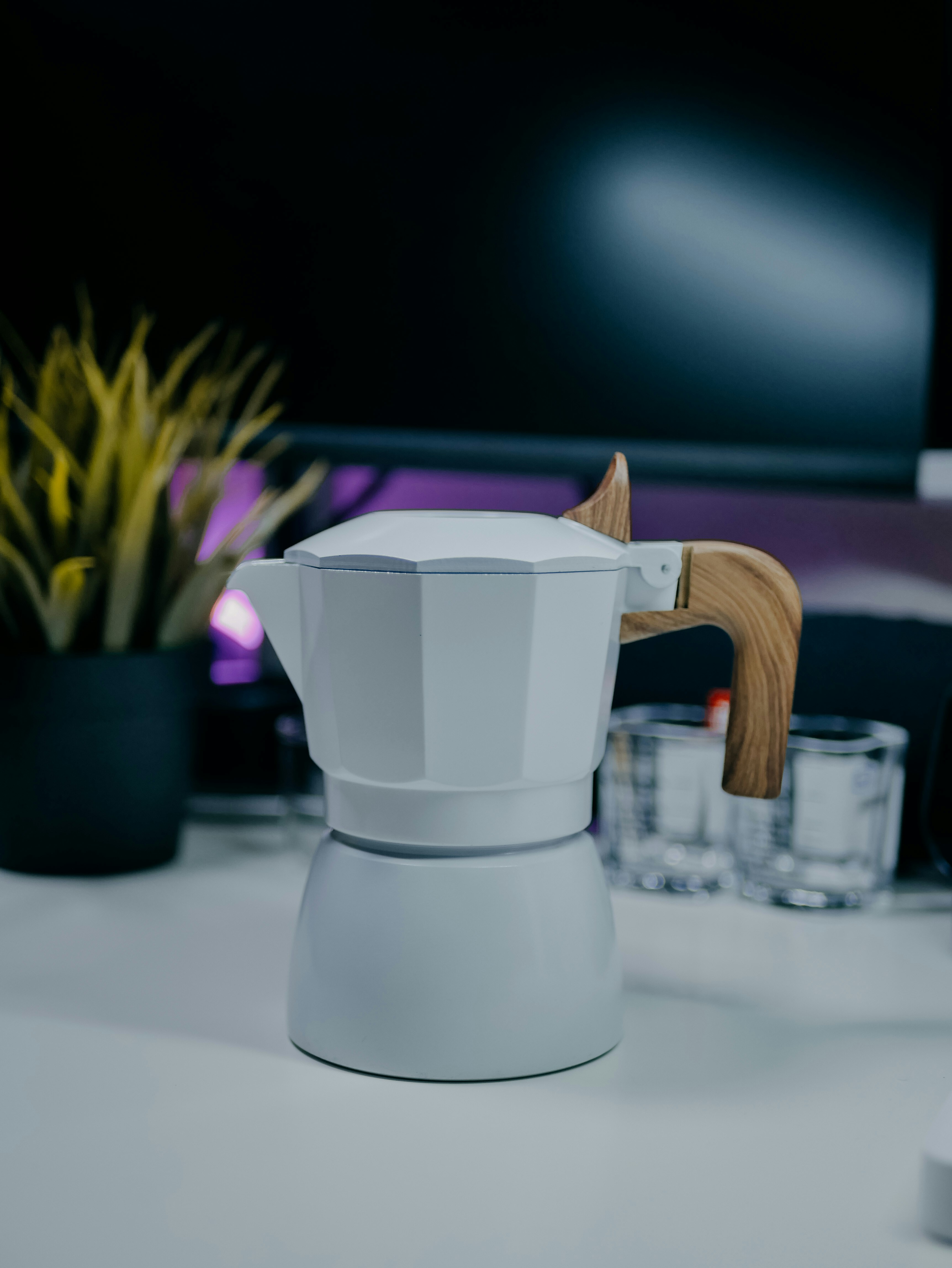 White Moka Pot on a Quiet Desk with Soft Backlight