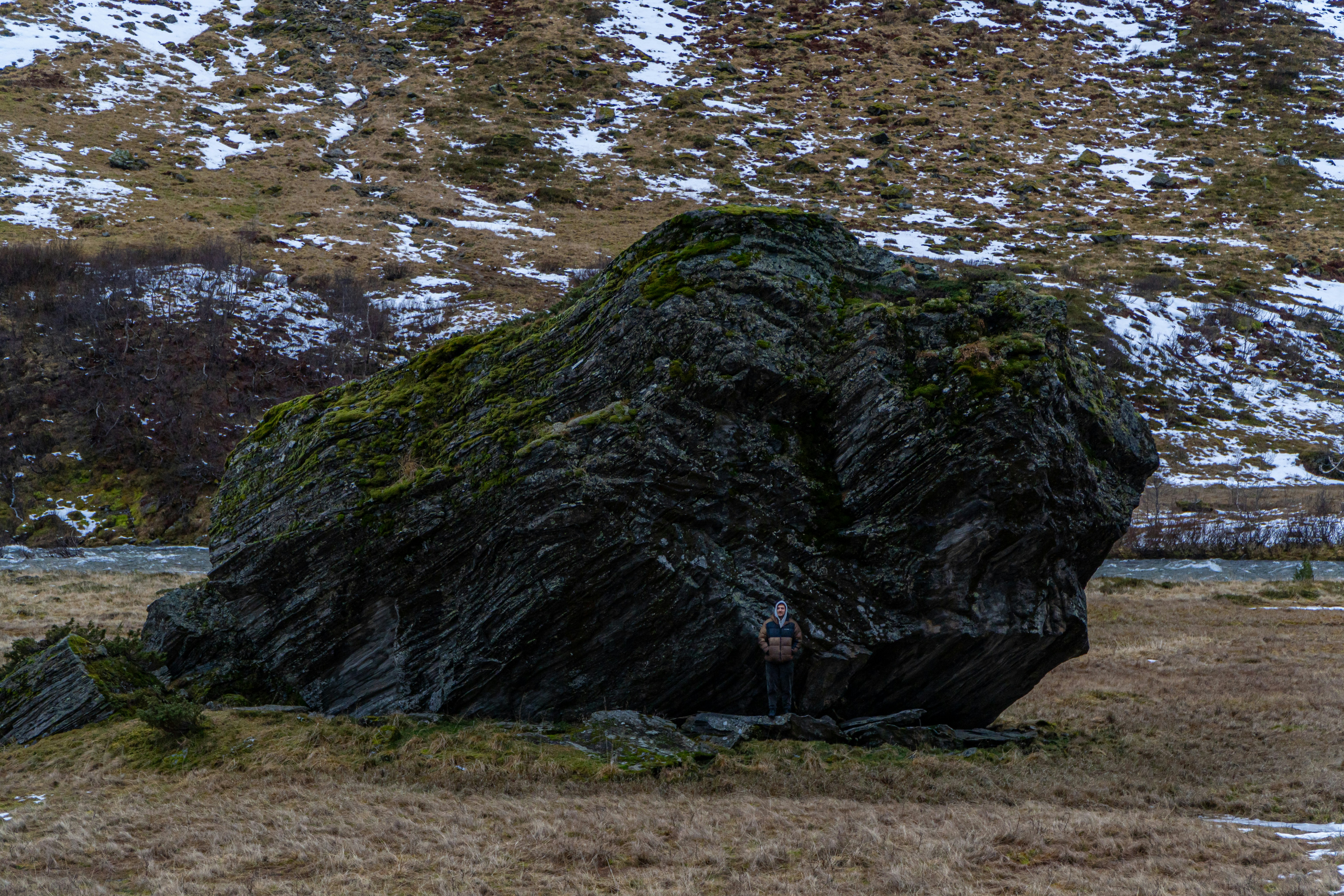 A large rock sitting in the middle of a field photo – Free Wallpaper ...