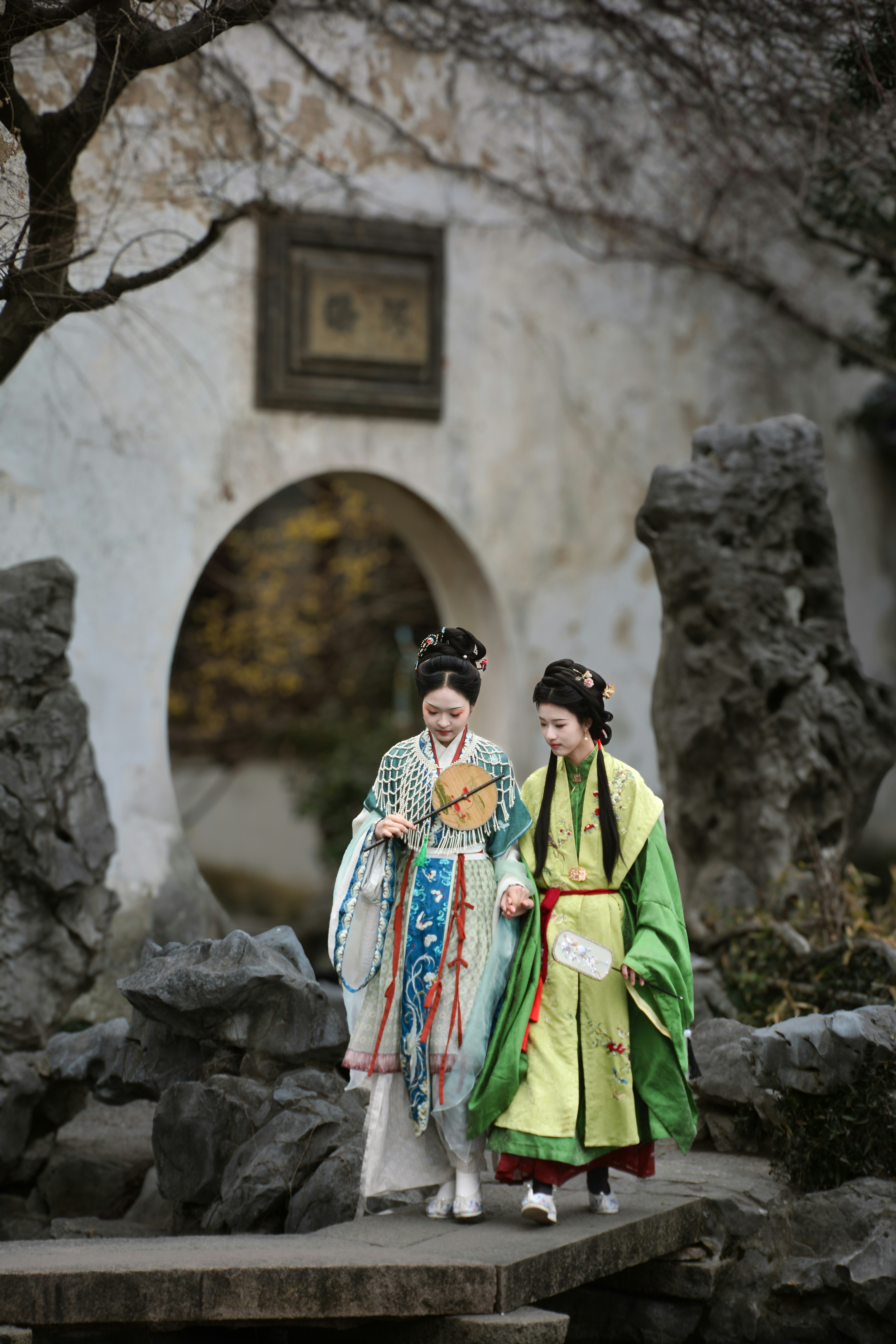 Silk and Stone: Two Hanfu Figures Step Through a Historic Courtyard