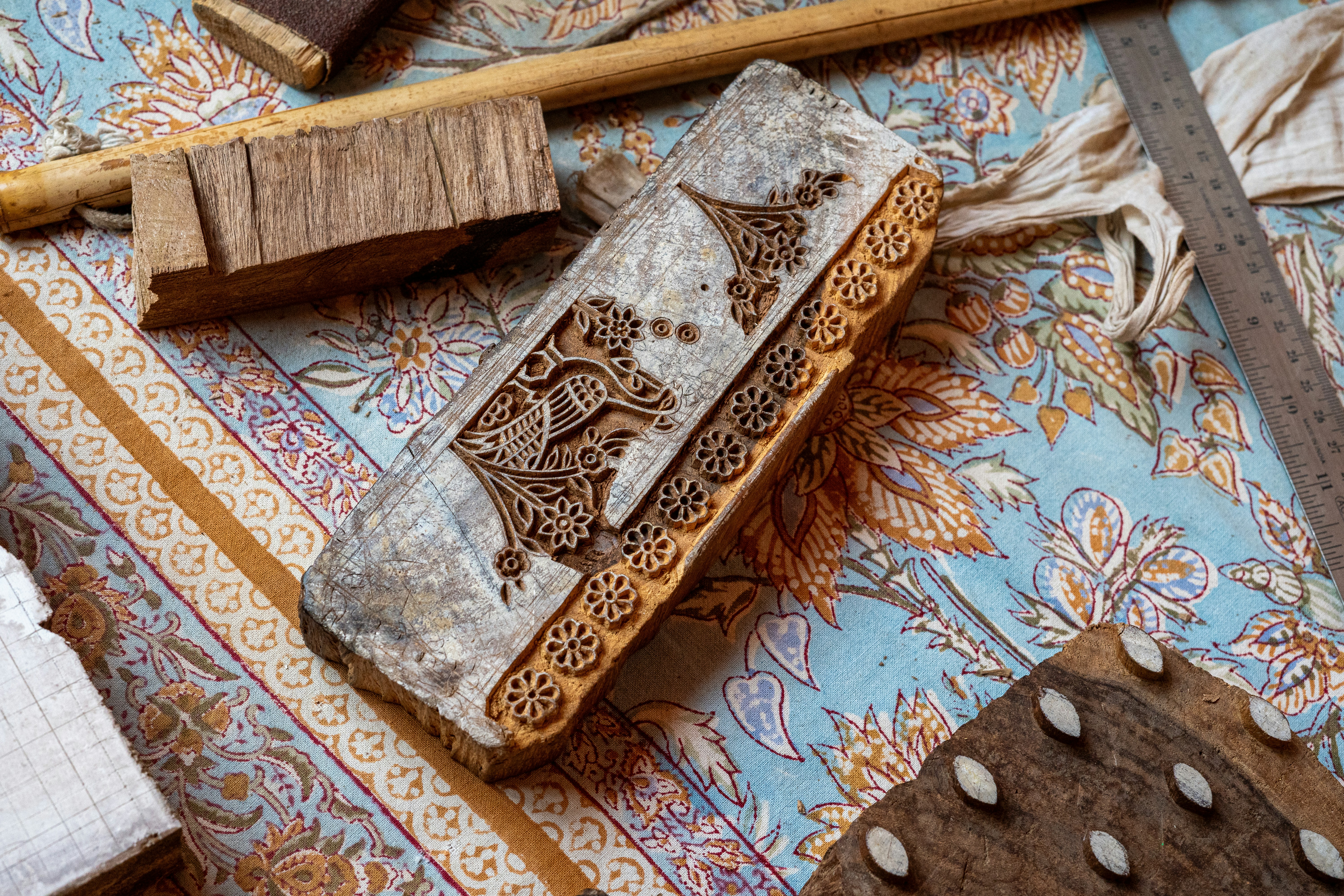 Decorative Carving Fragments on Floral Tablecloth