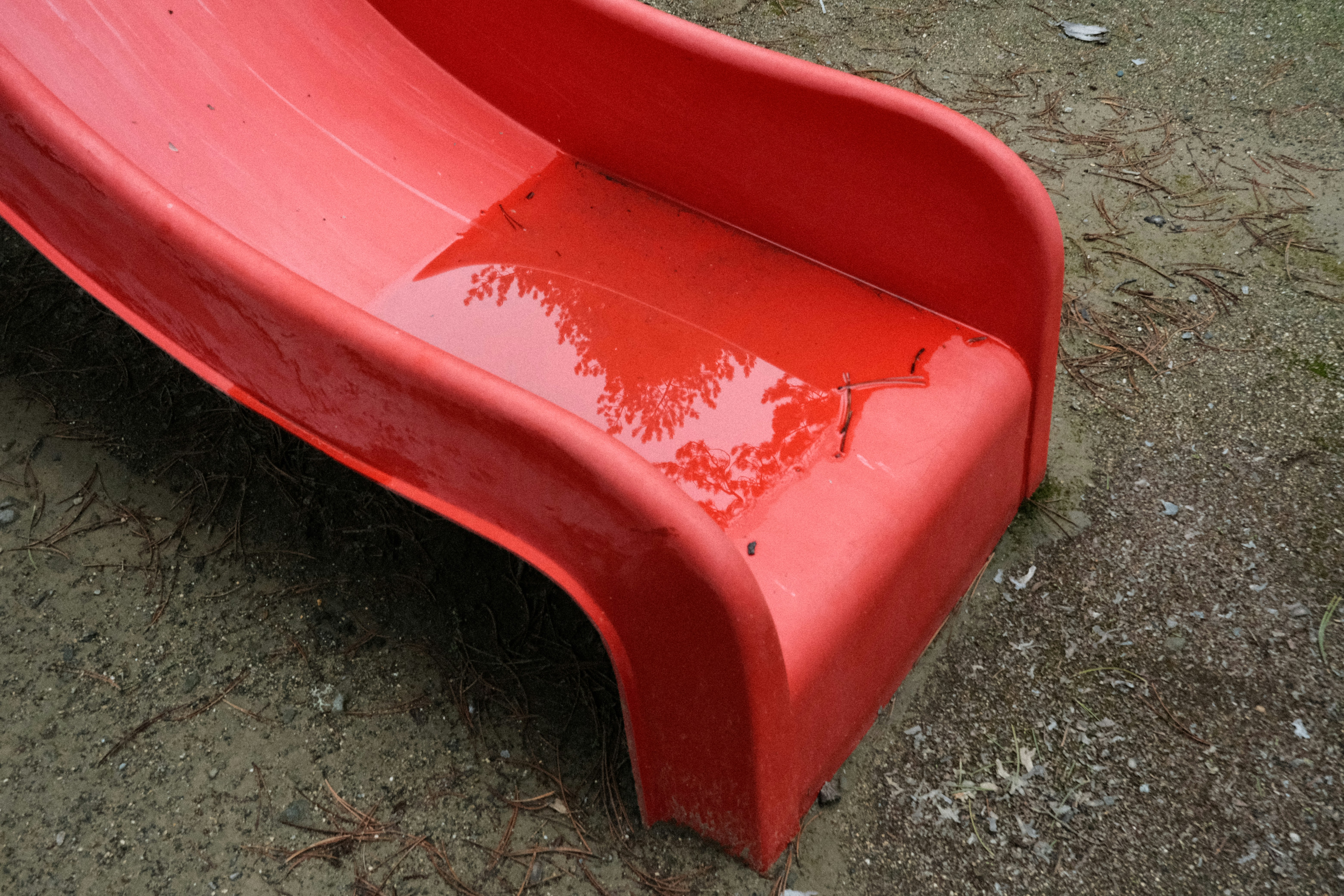 A red bench sitting on top of a dirt field photo – Free Abstract Image ...