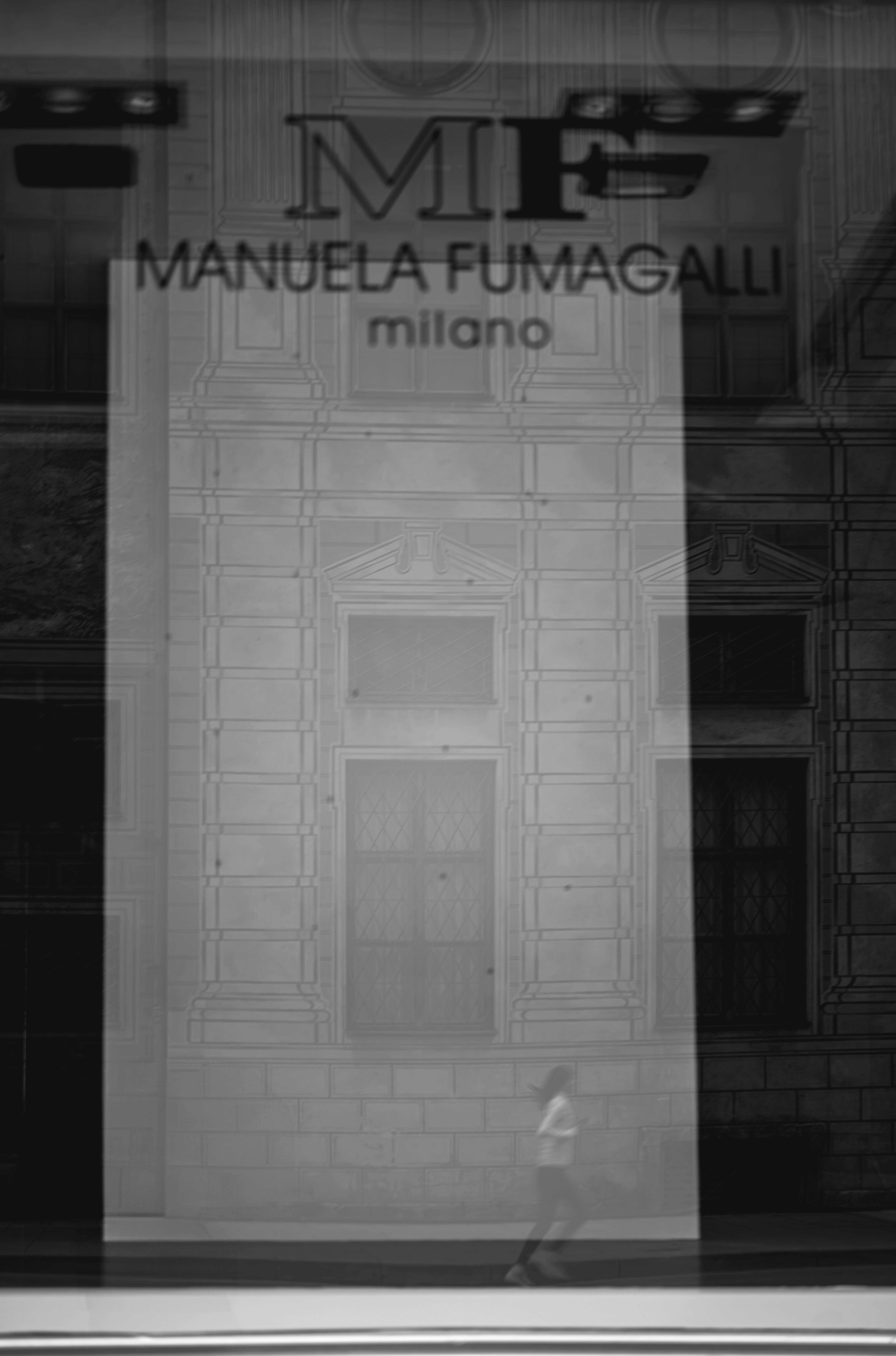 A man walking past a window with a sign on it photo – Free Munich Image ...
