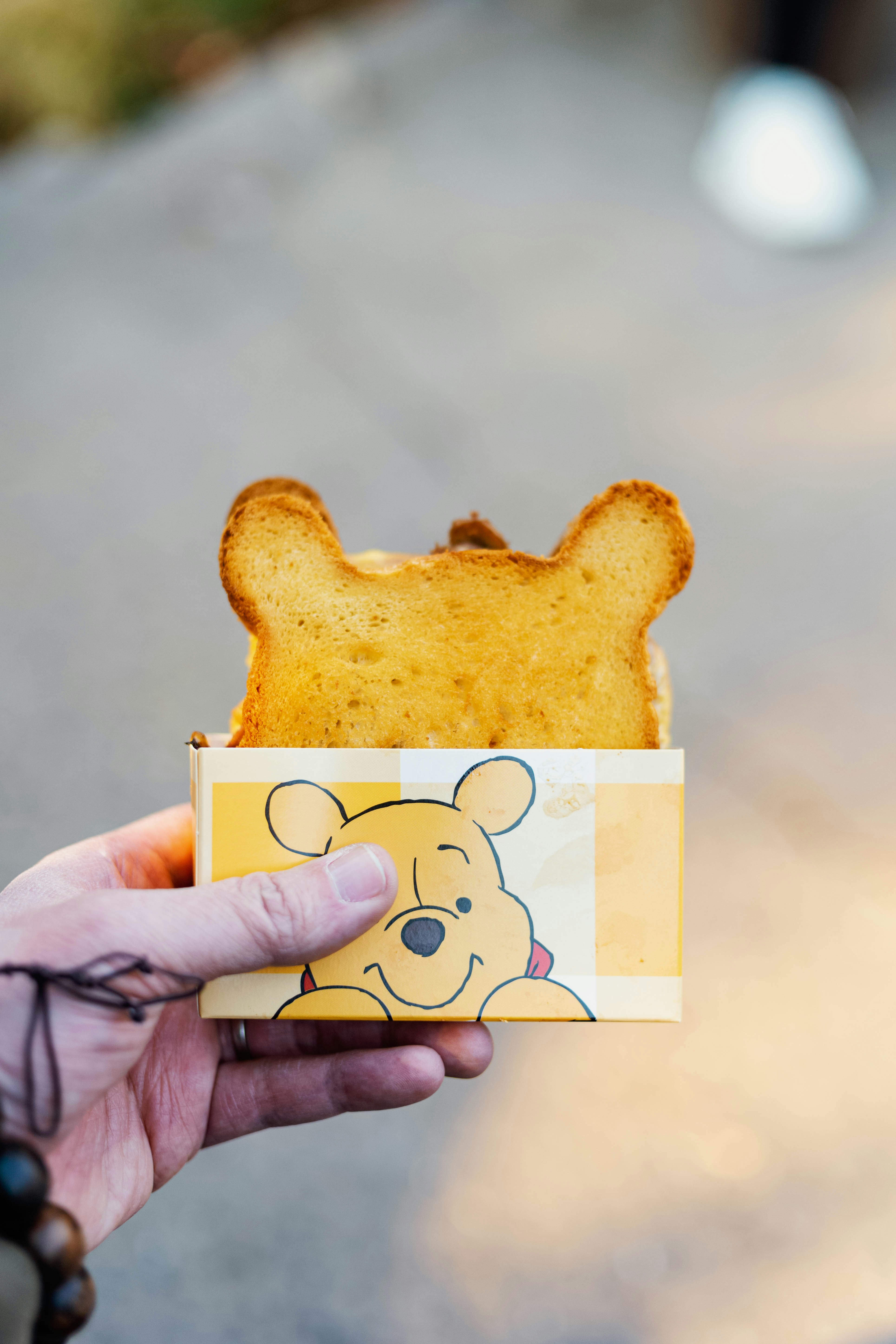 Bear-Eared Toast in Hand: A Small Moment of Snacktime Delight