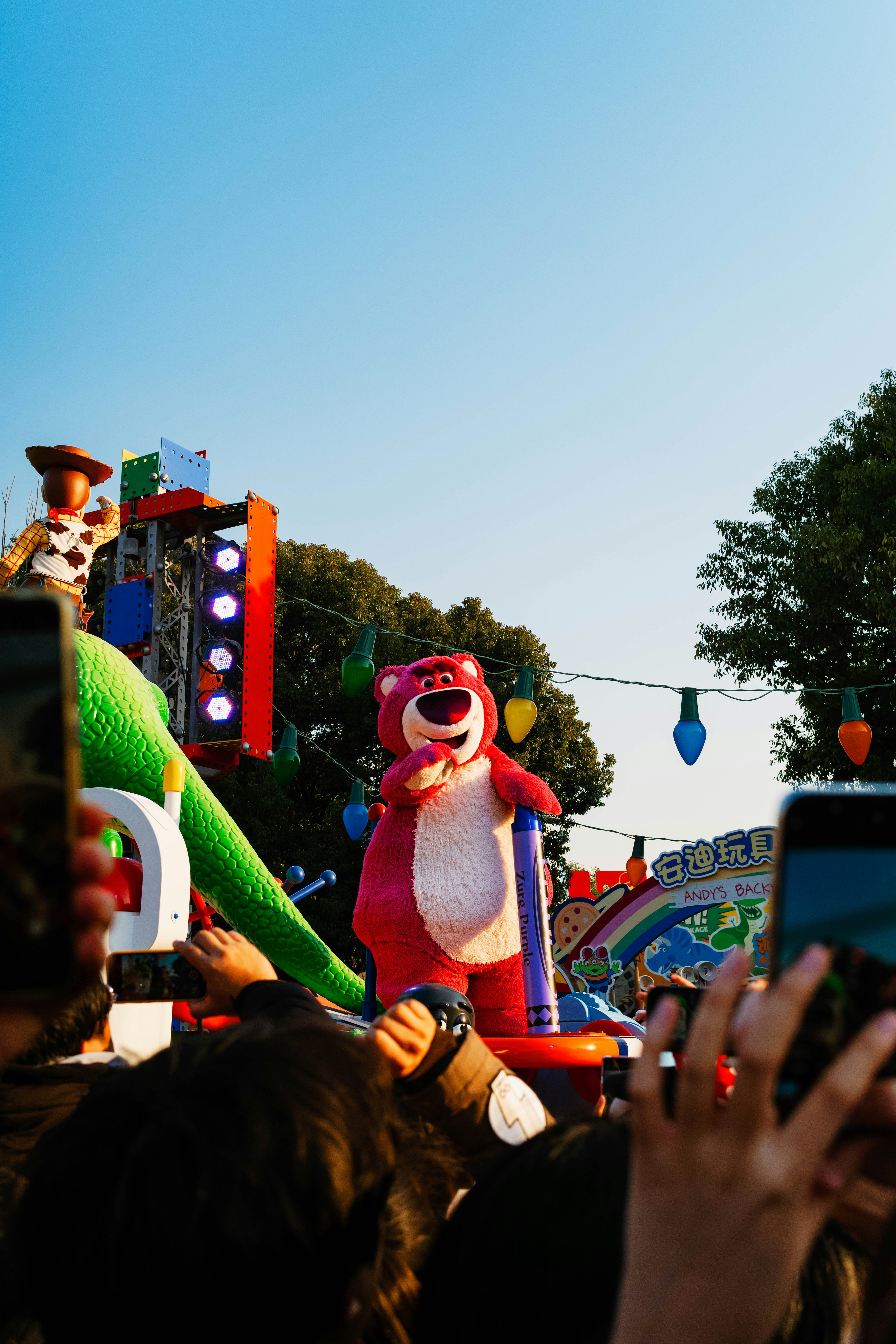 Magenta Mascot on a Colorful Parade Stage Amid Cheerful Lights
