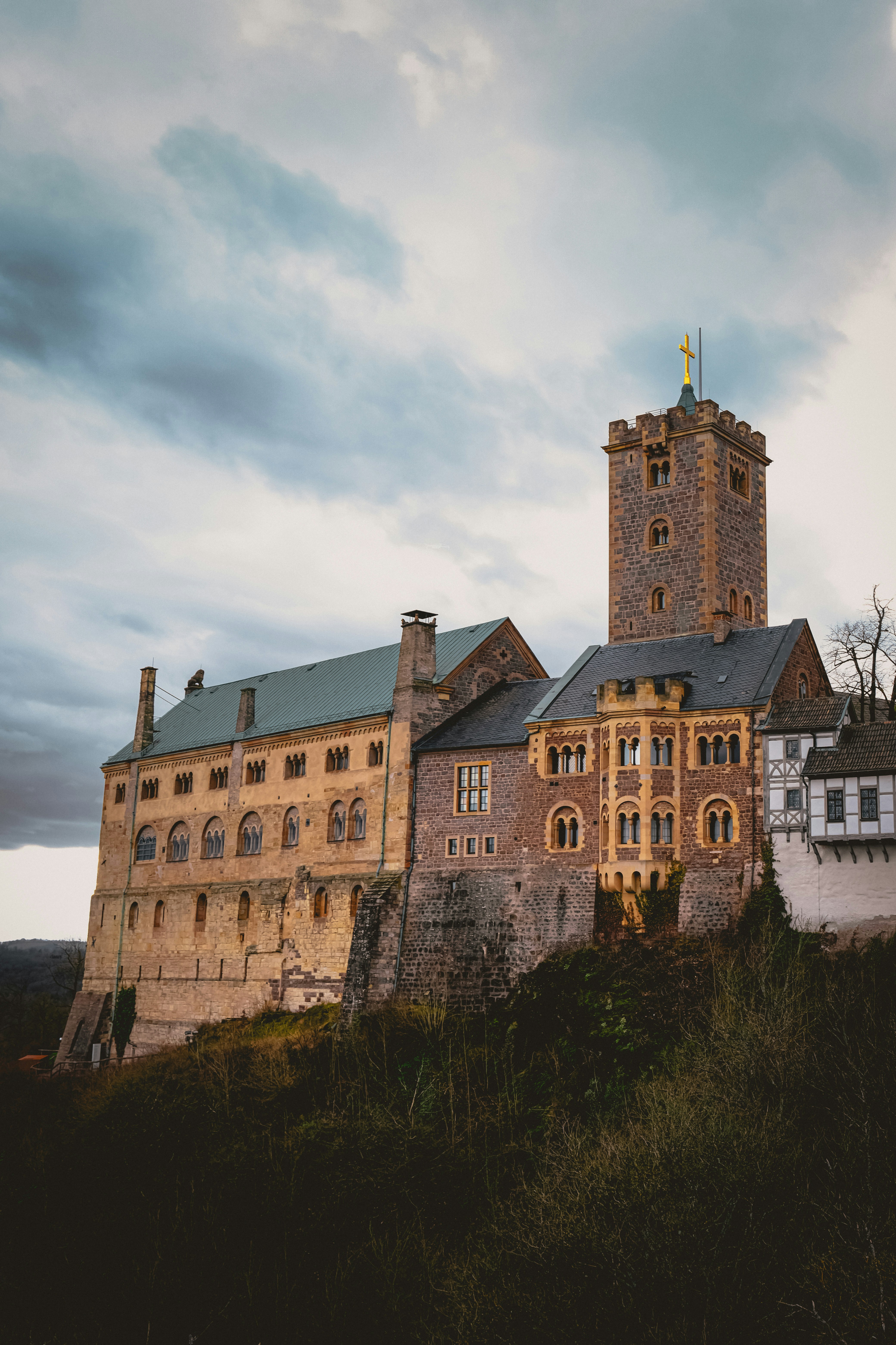 Castle on the Crest: Weathered stone towers under a brooding sky