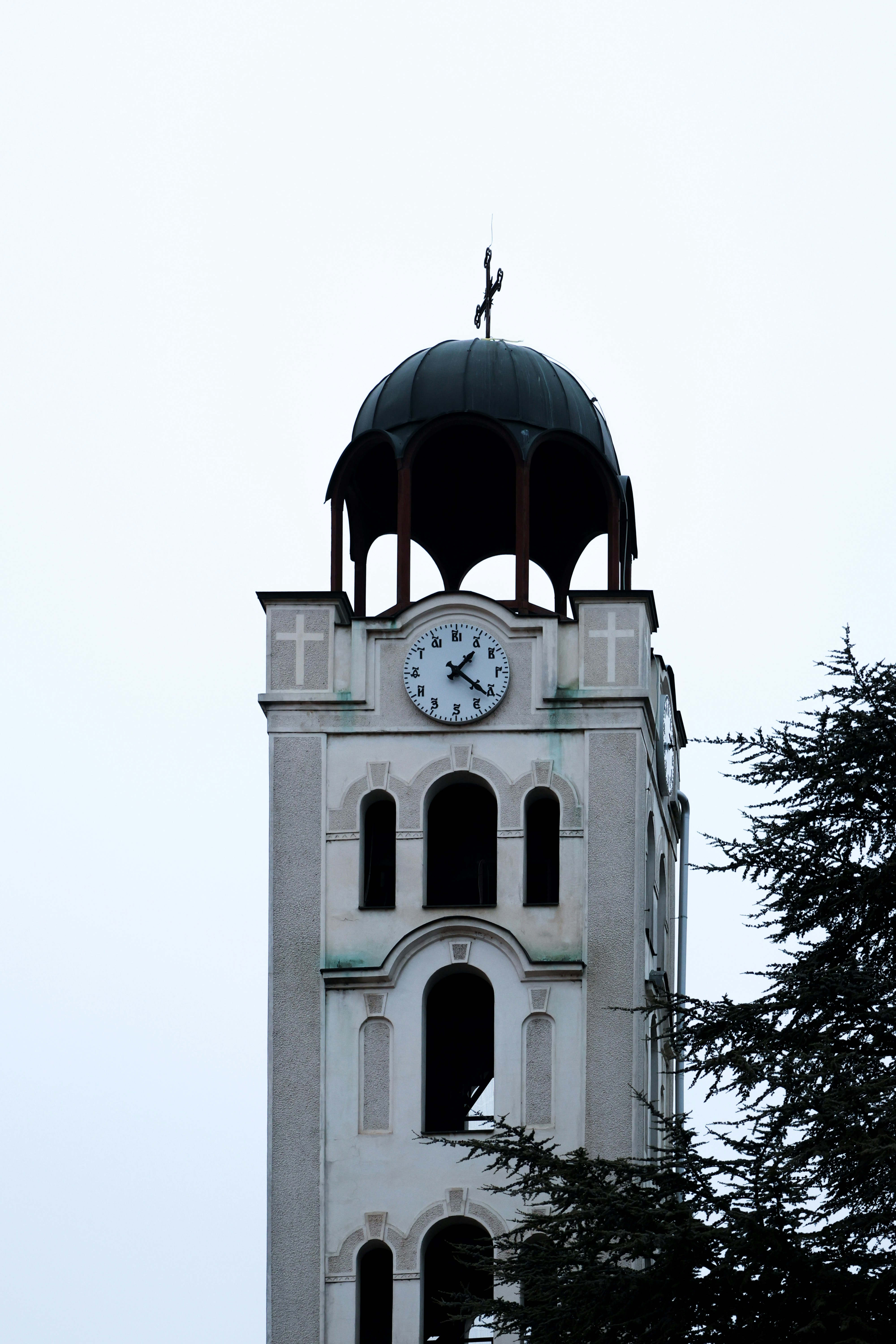 A large white clock tower with a black roof photo – Free Tower Image on ...