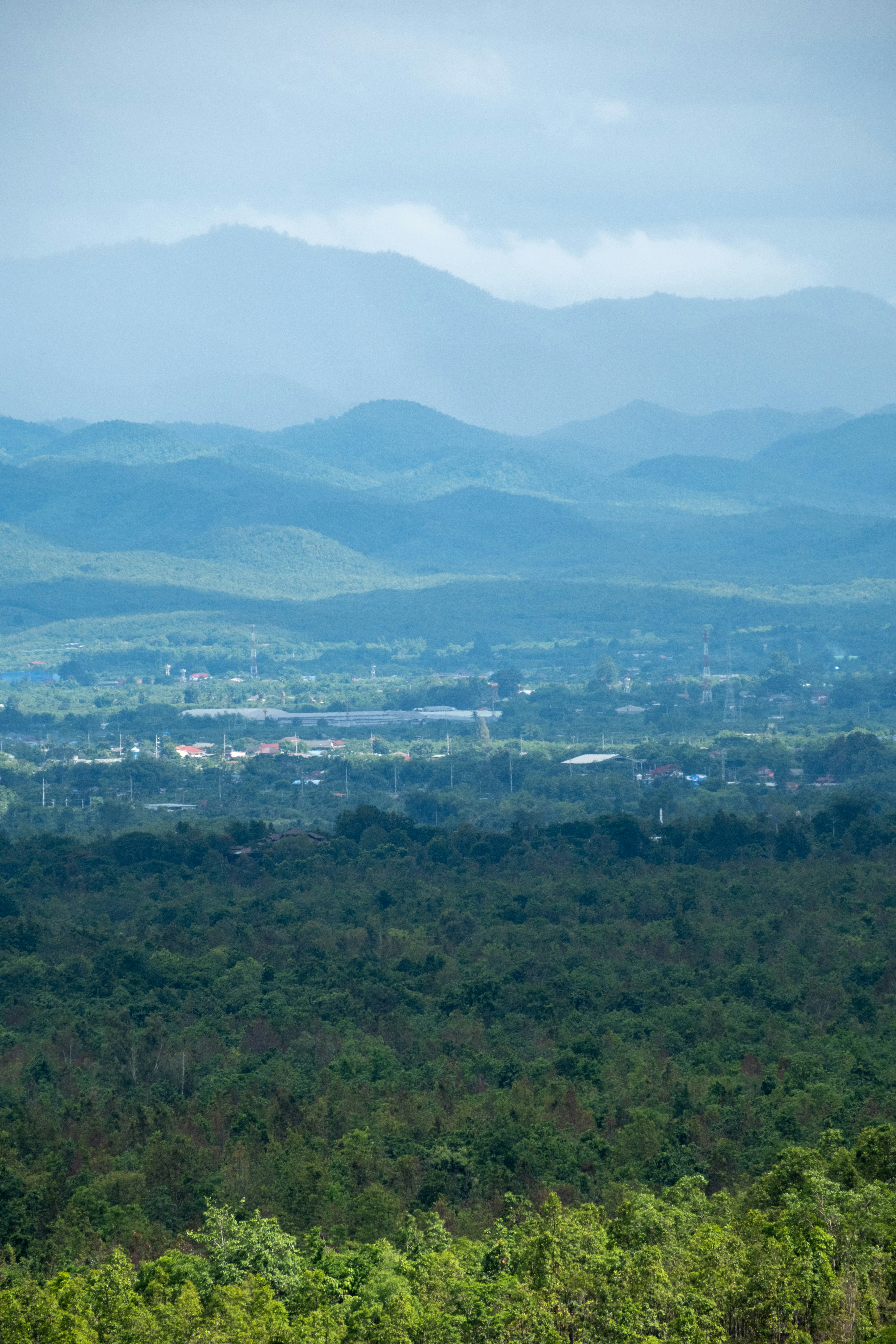 A view of a mountain range from a distance photo – Free Mountains Image ...