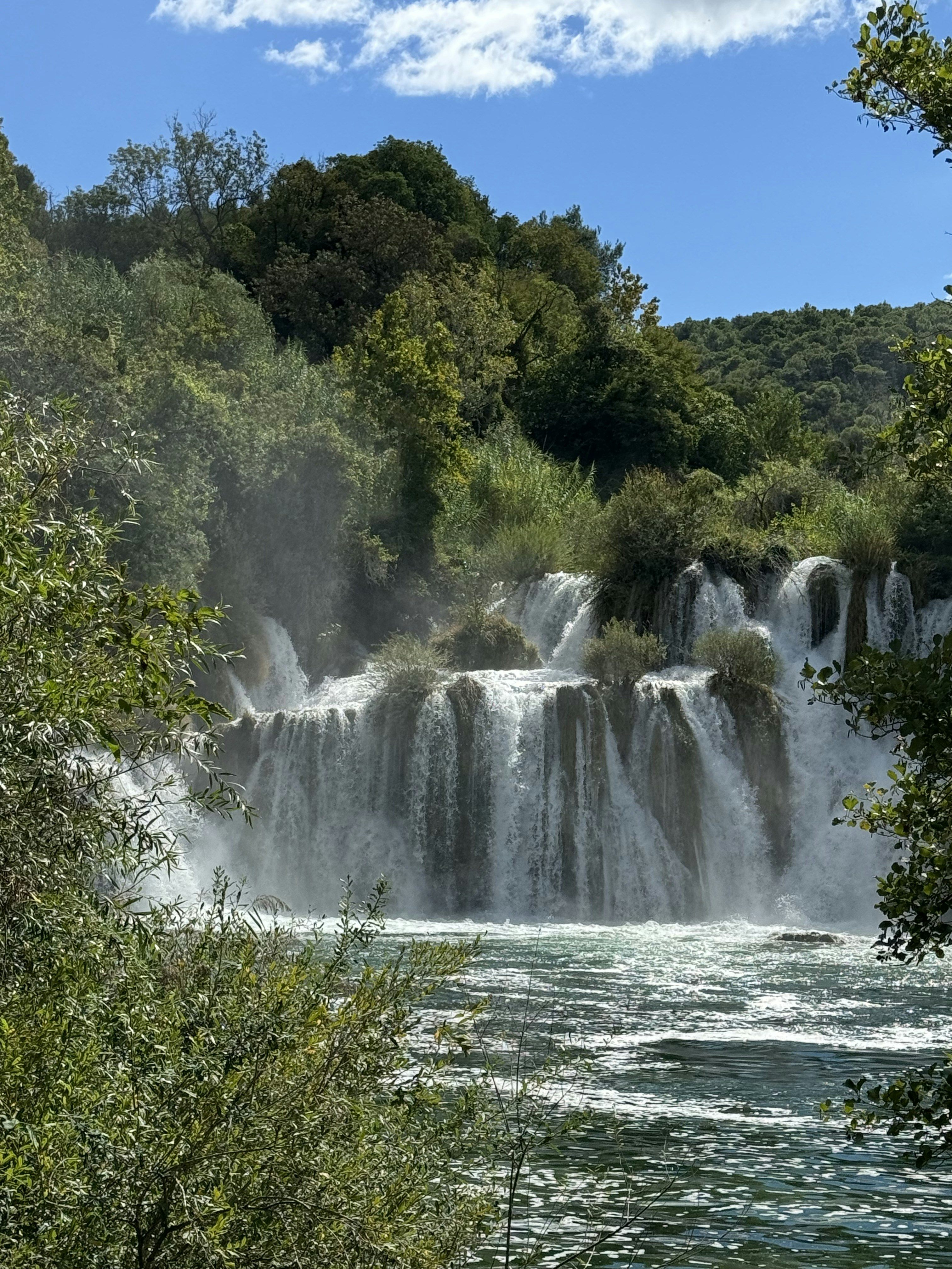 A view of a waterfall from the side of a river photo – Free Waterfall ...