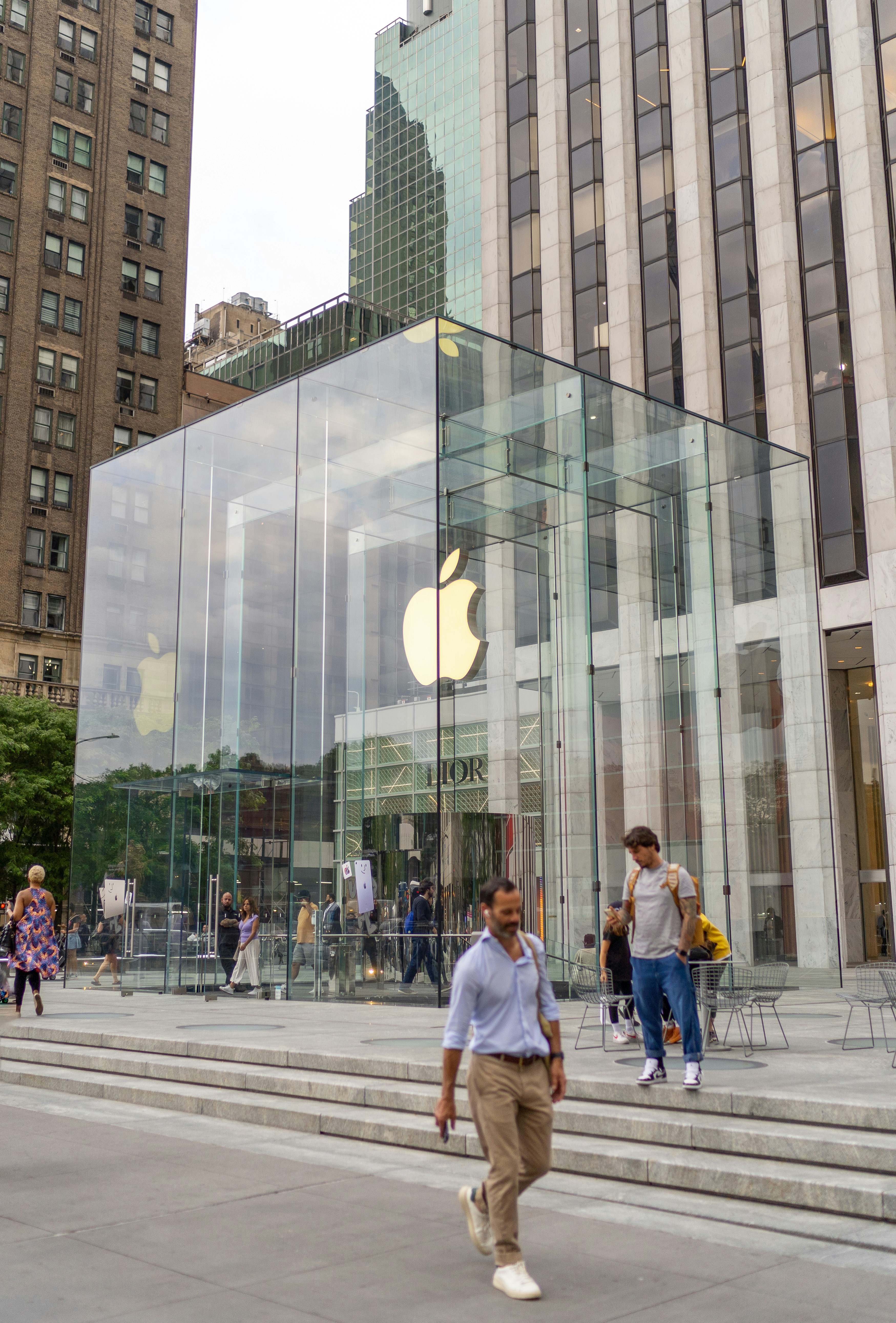 Glass Cube of Cupertino Echoes on a New York Street