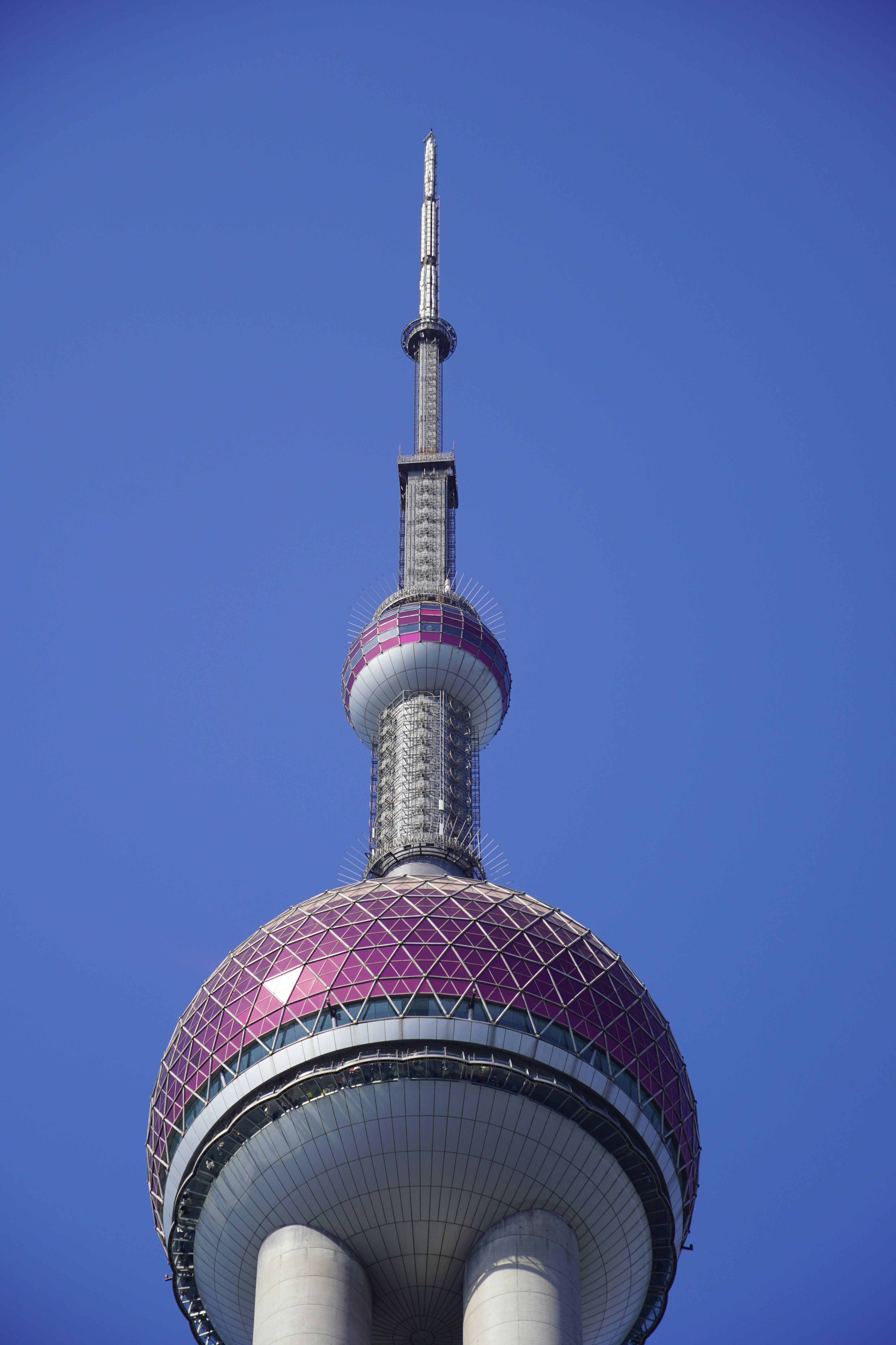 Magenta Dome Rising: A Skyward Spire Against Azure