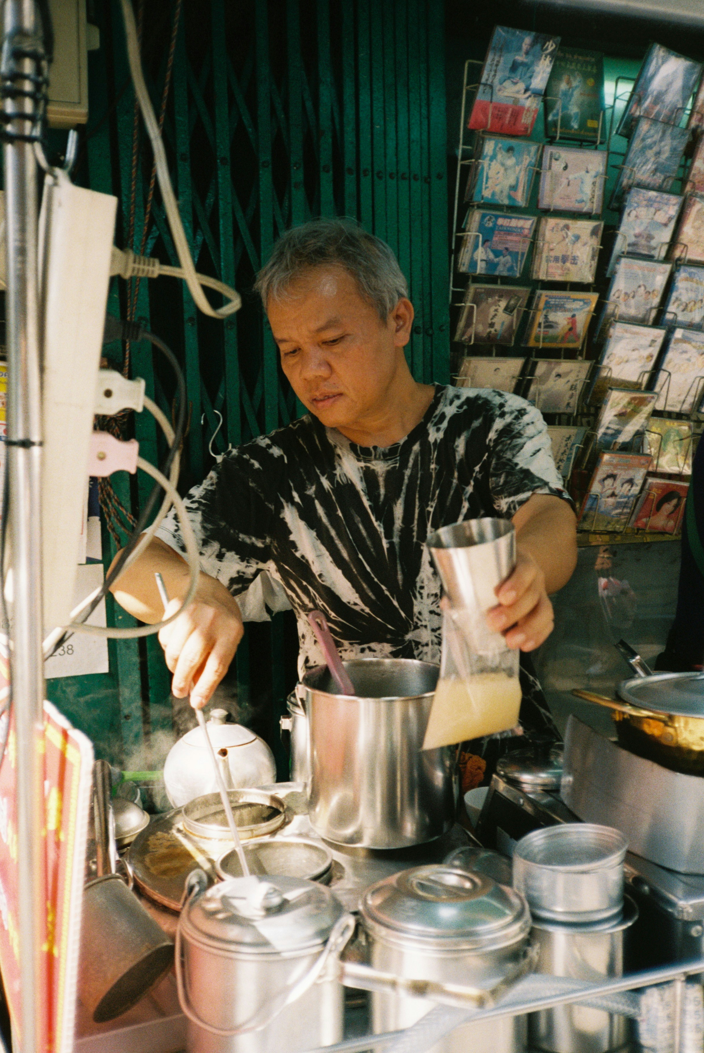 Sizzle and Steam: A Street Vendor in Focus