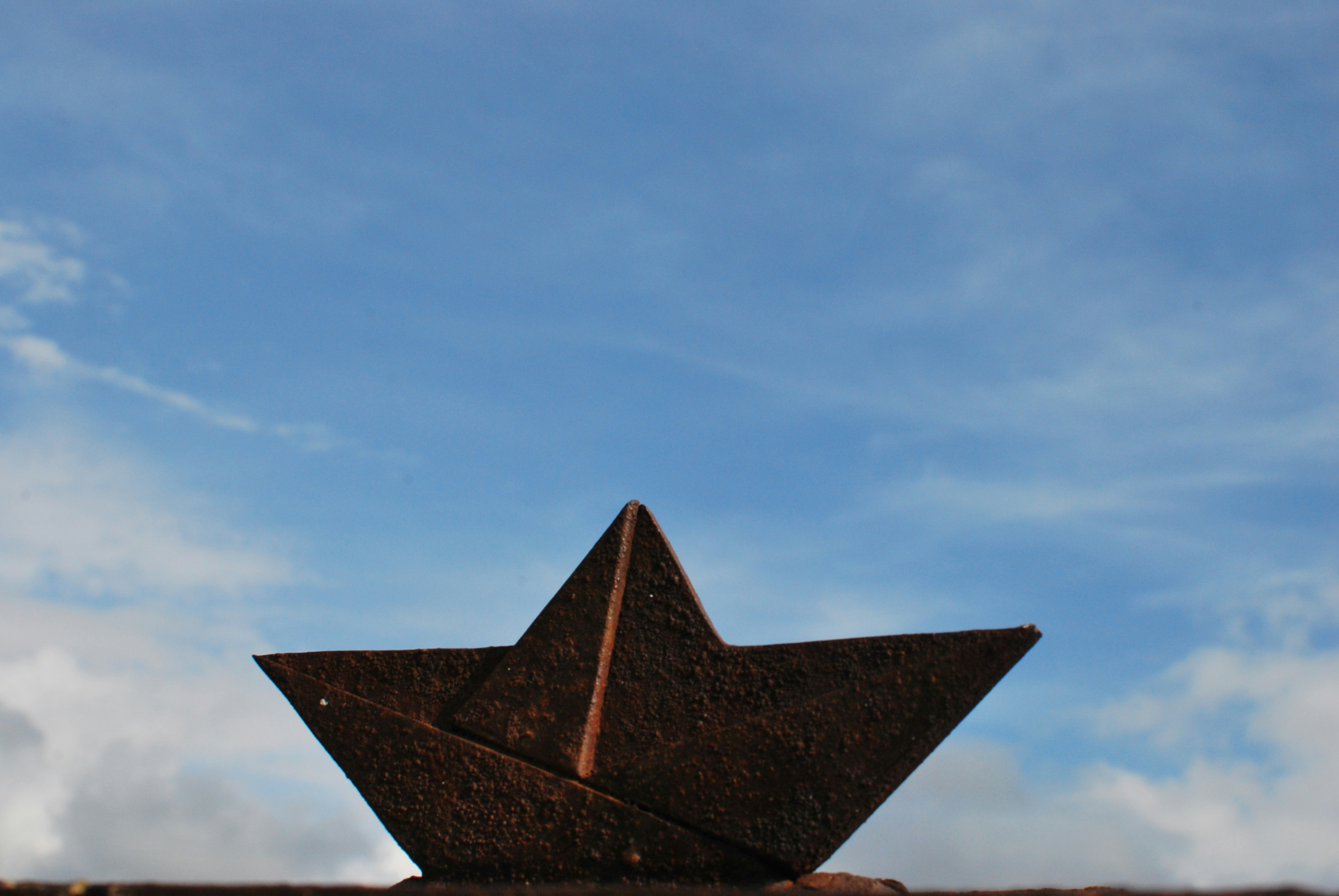 Rusty Star Silhouette Over a Crisp Blue Sky