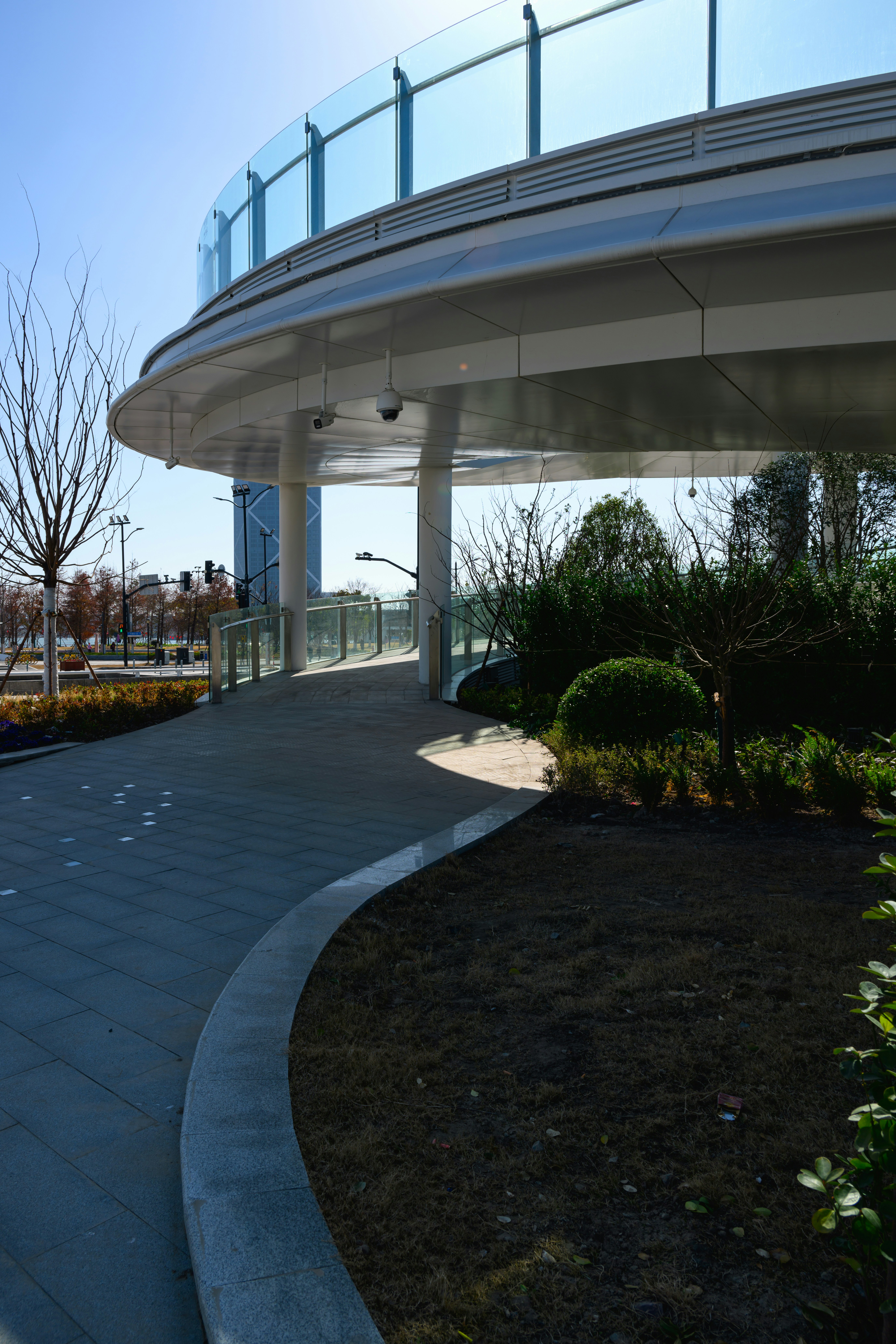 A circular building with a walkway leading to it photo – Free Pudong ...