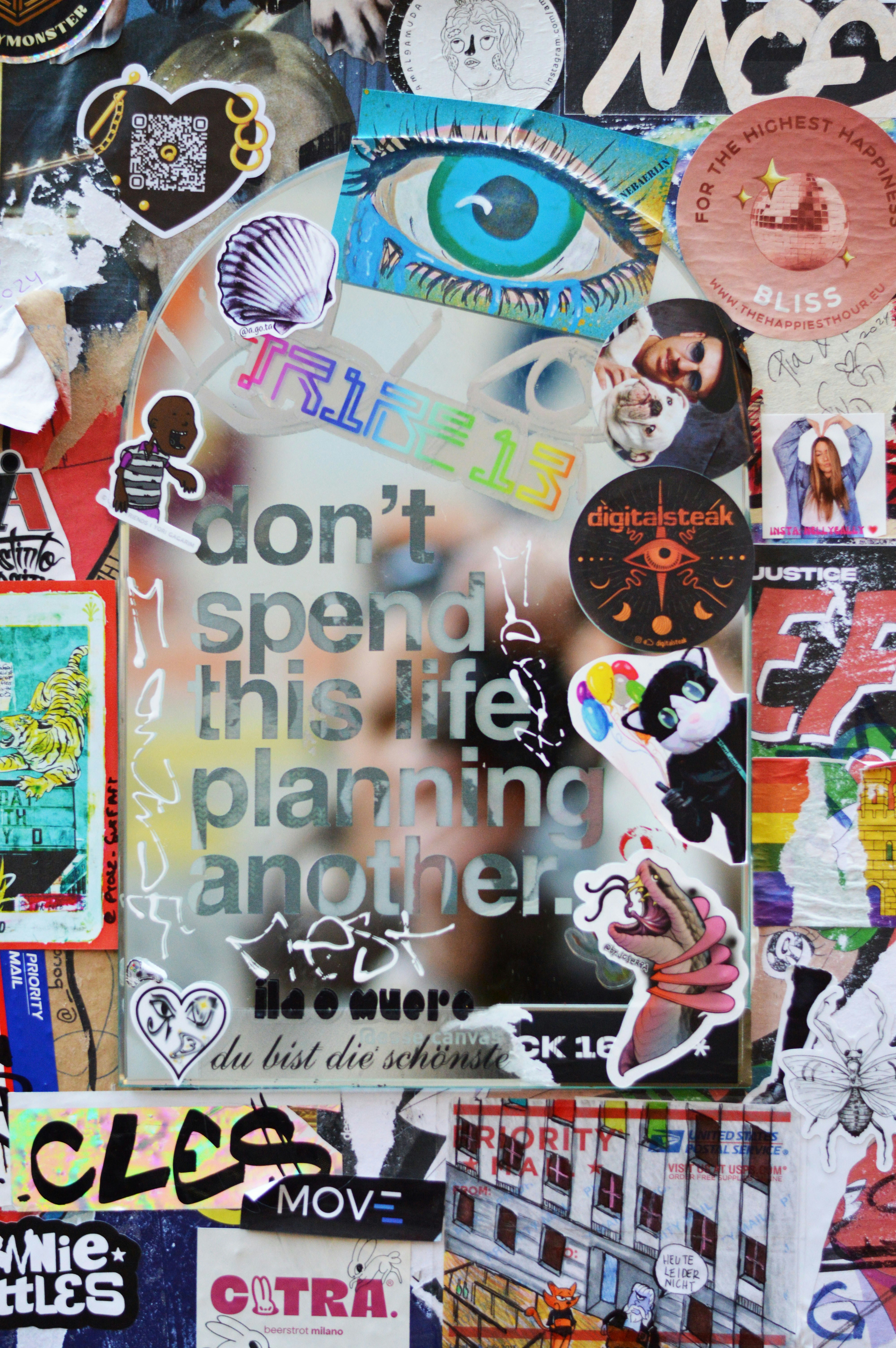 A collage of stickers and decals on a wall photo – Free Art Image on ...