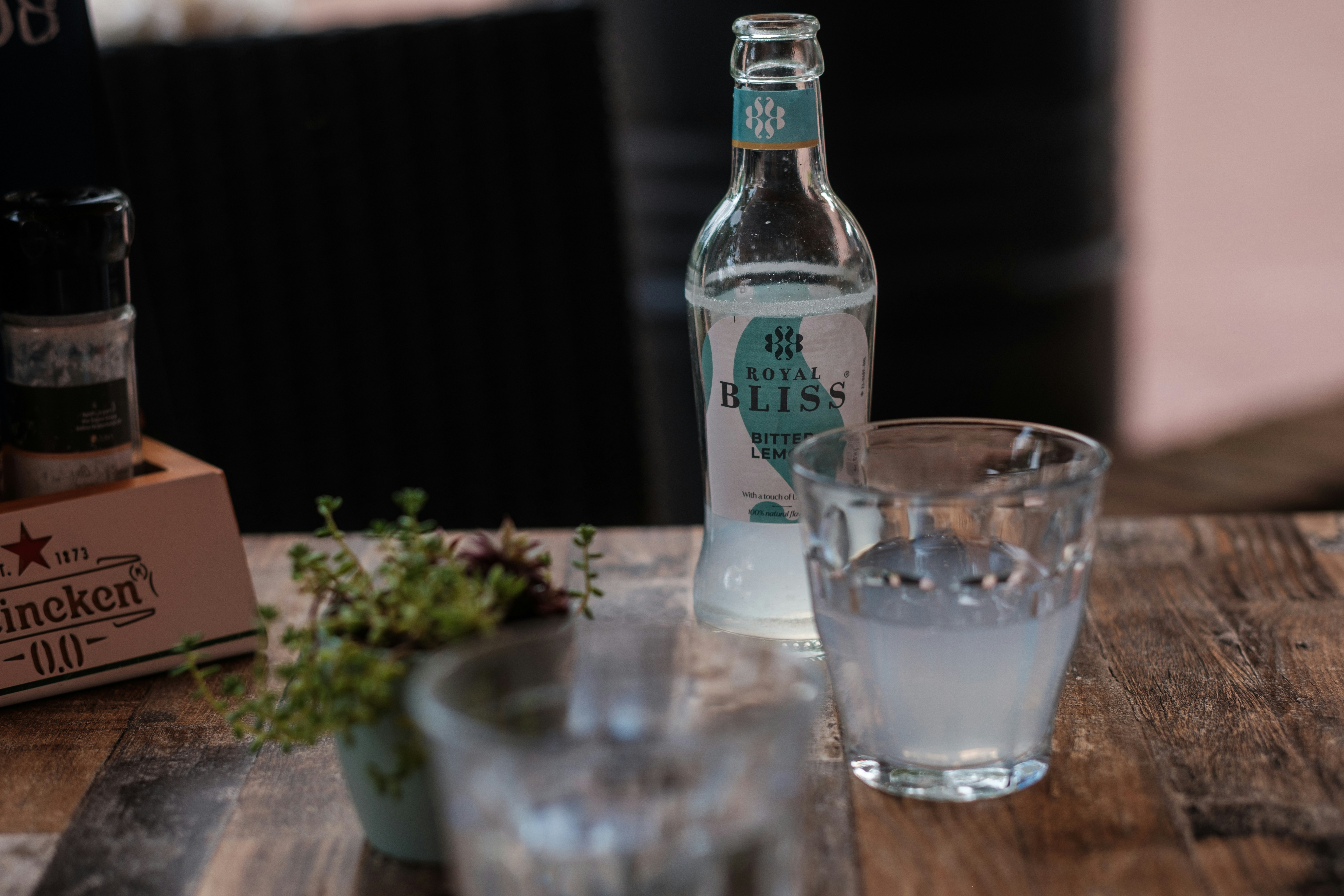 Bottled calm: a centerpiece of clarity on a rustic table