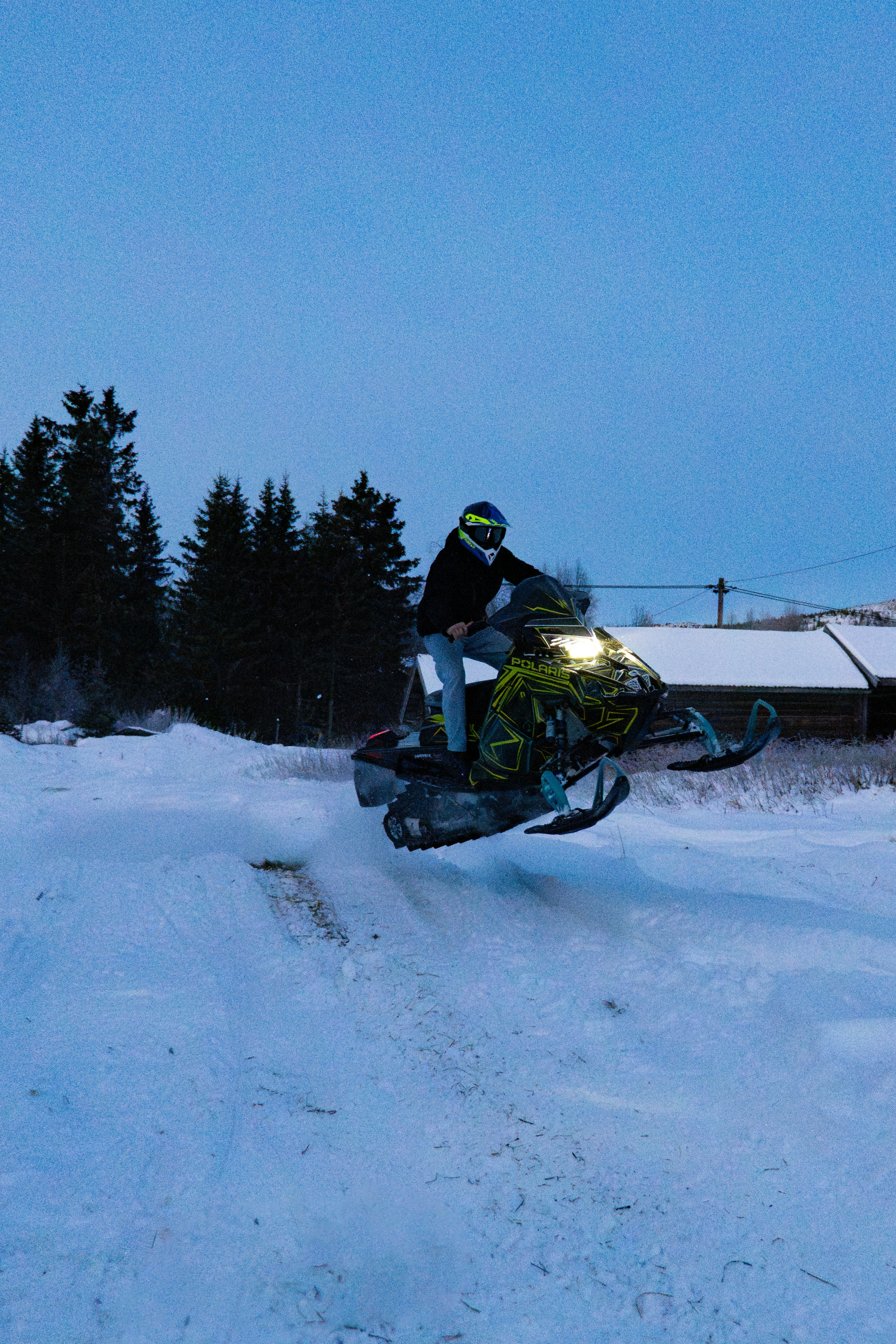 A person riding a snowmobile in the snow photo – Free Ljørdalen Image ...