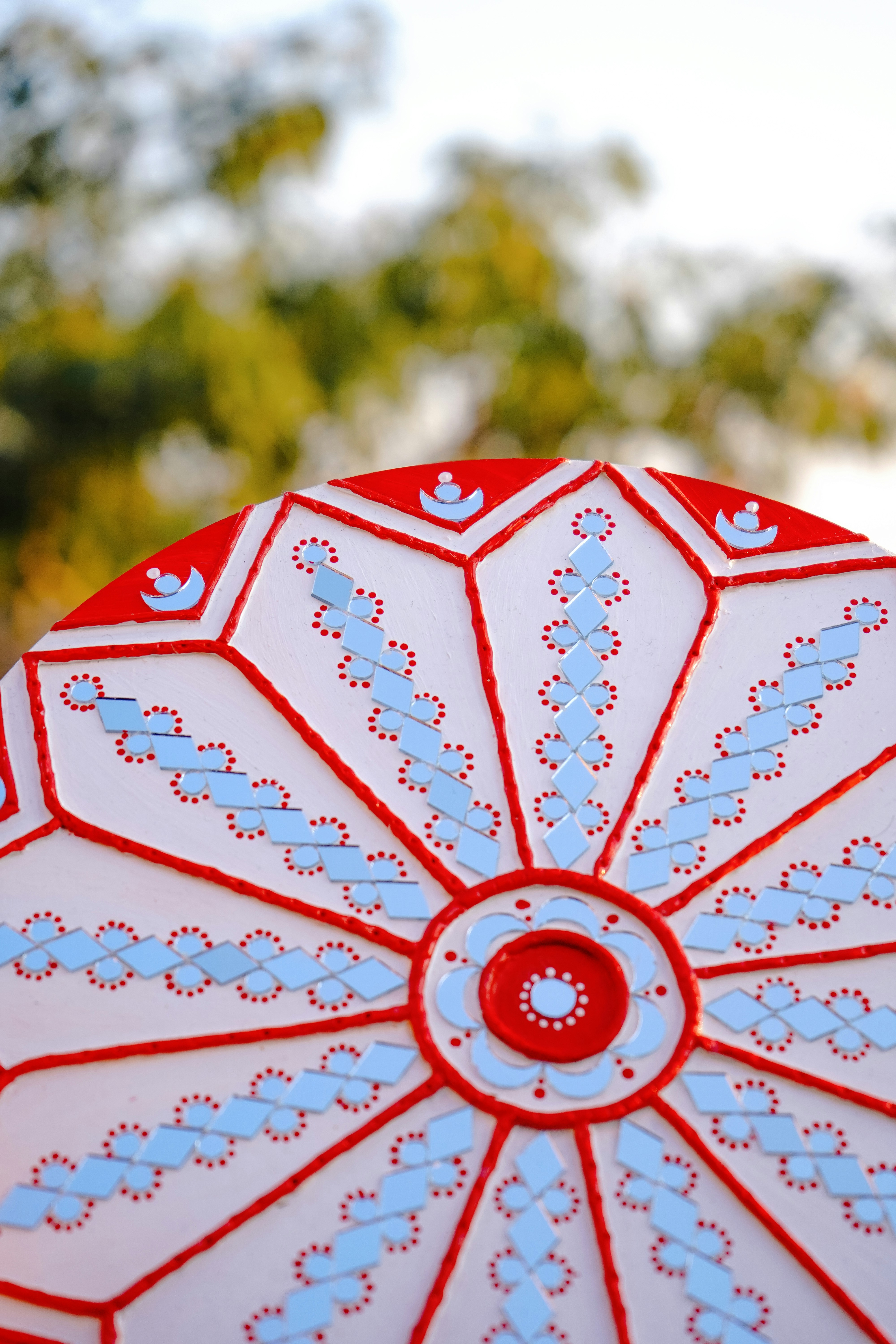 Red symmetry: a patterned parasol rooted in color and craft