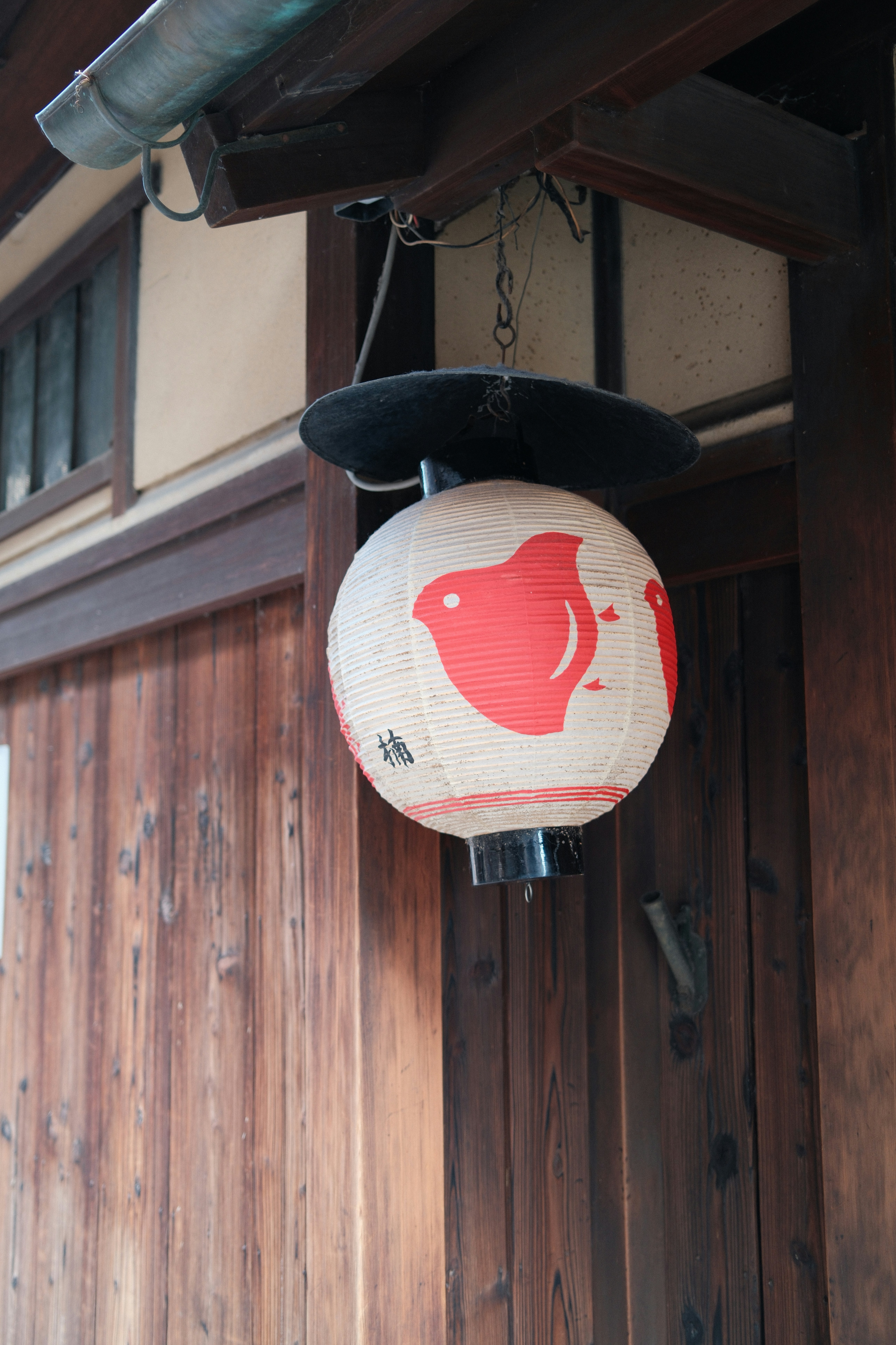 A lantern hanging from the side of a building photo – Free Japan Image ...
