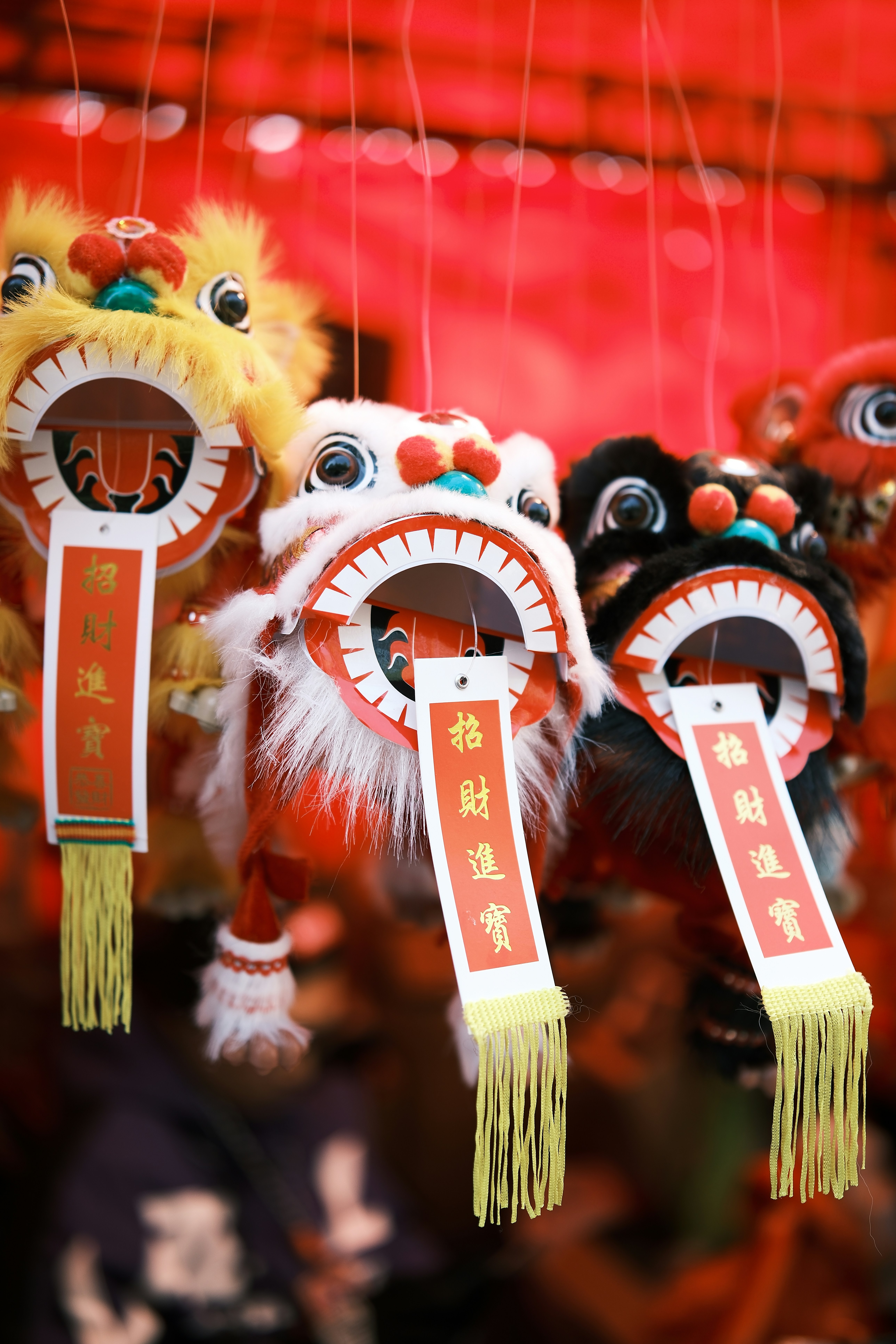 A group of chinese masks hanging from strings photo – Free Chinese new ...