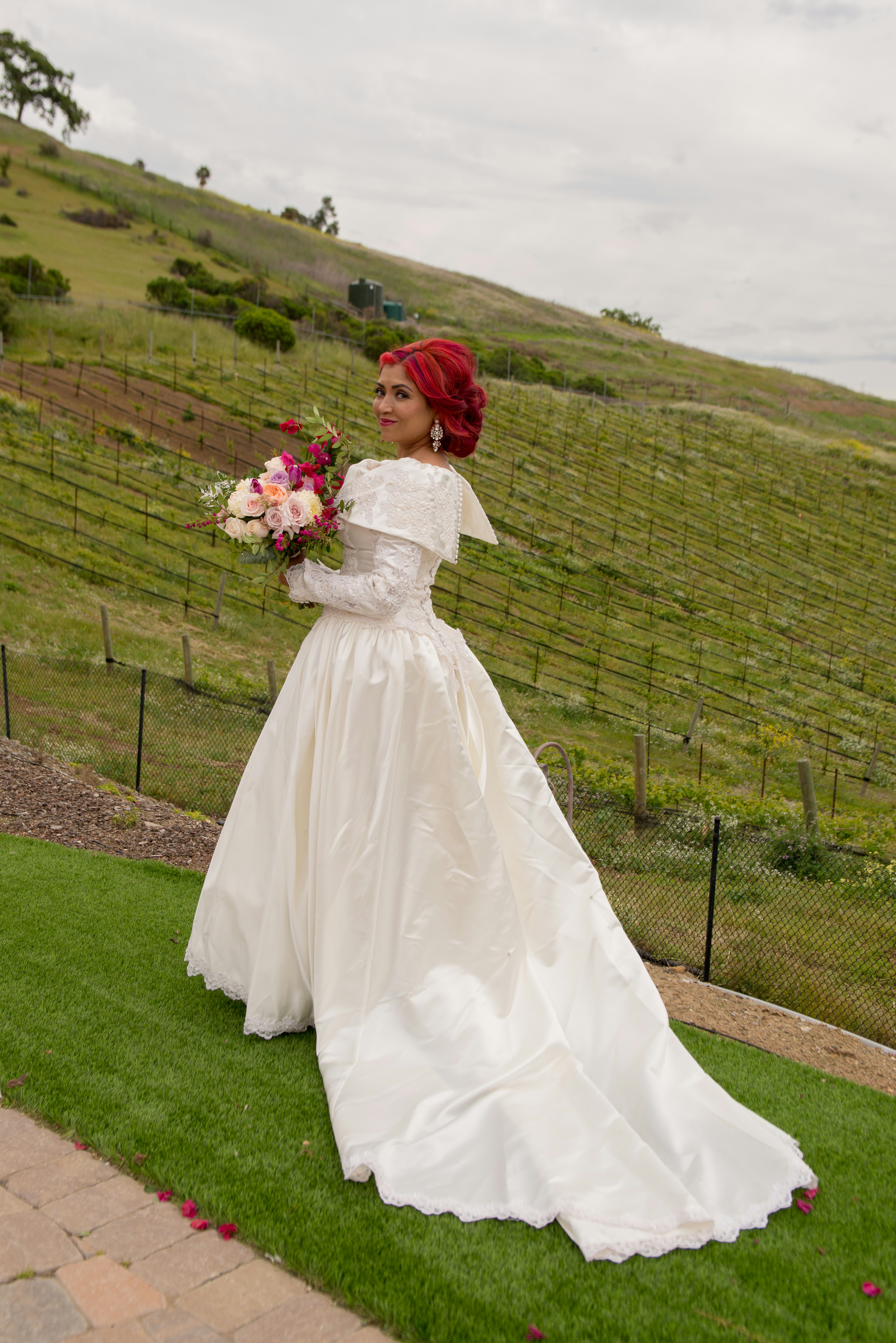 Satin Train Amid Vineyard Rows: A Bride's Quiet Radiance