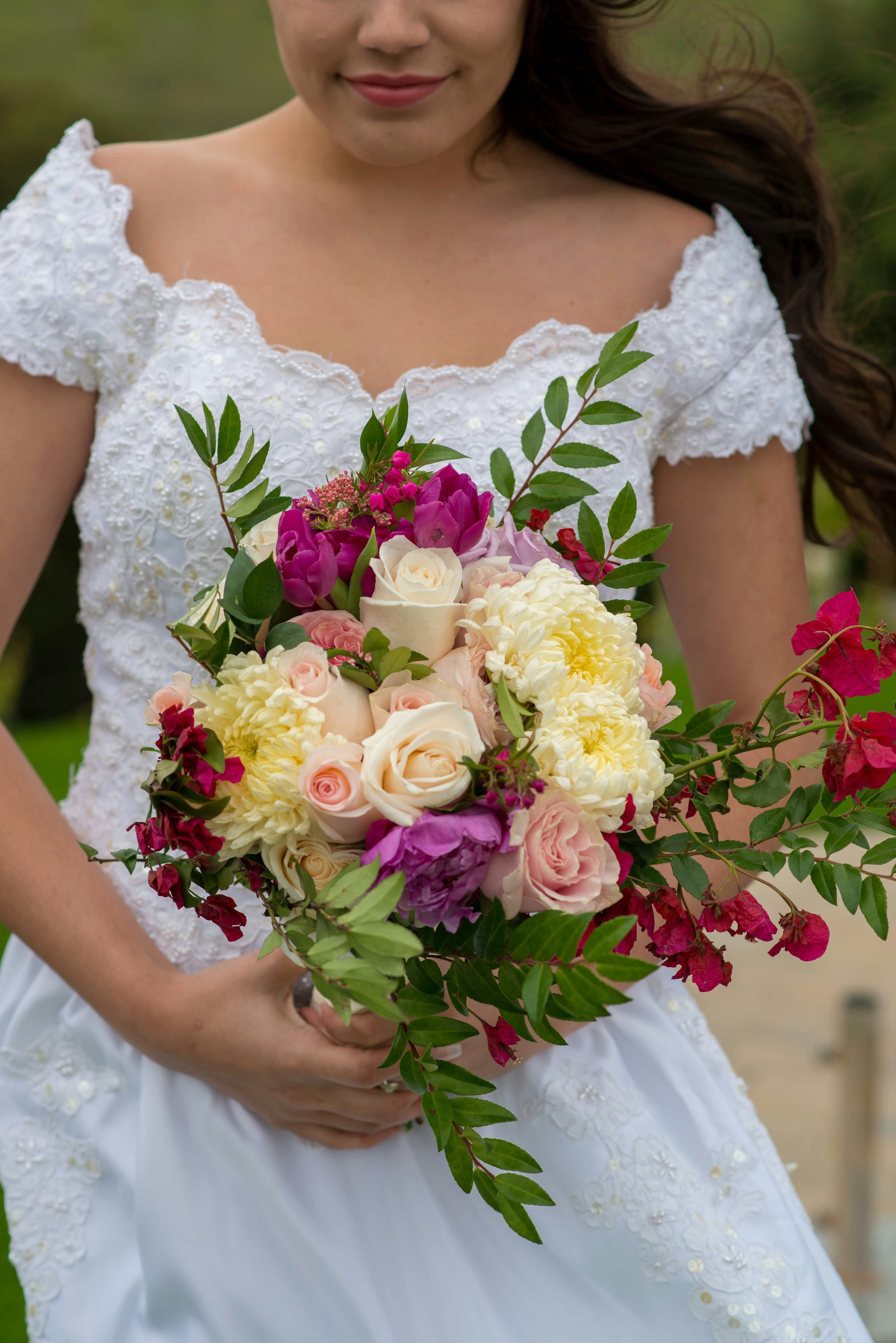 Bouquet in Bloom: A Bridal Moment Framed by Lace
