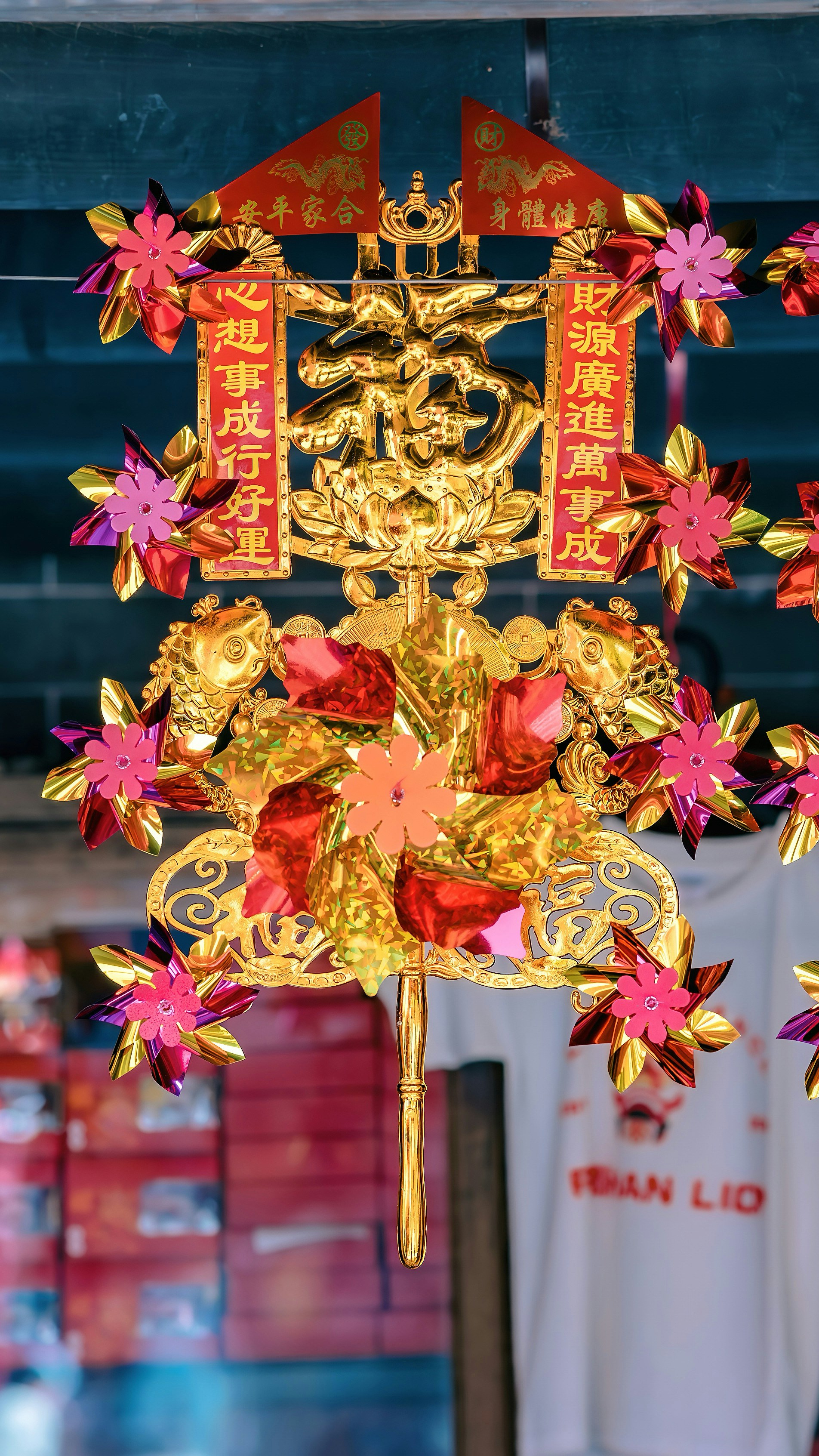 Gilded Fortune Lantern Framed by Pink Floral Accents