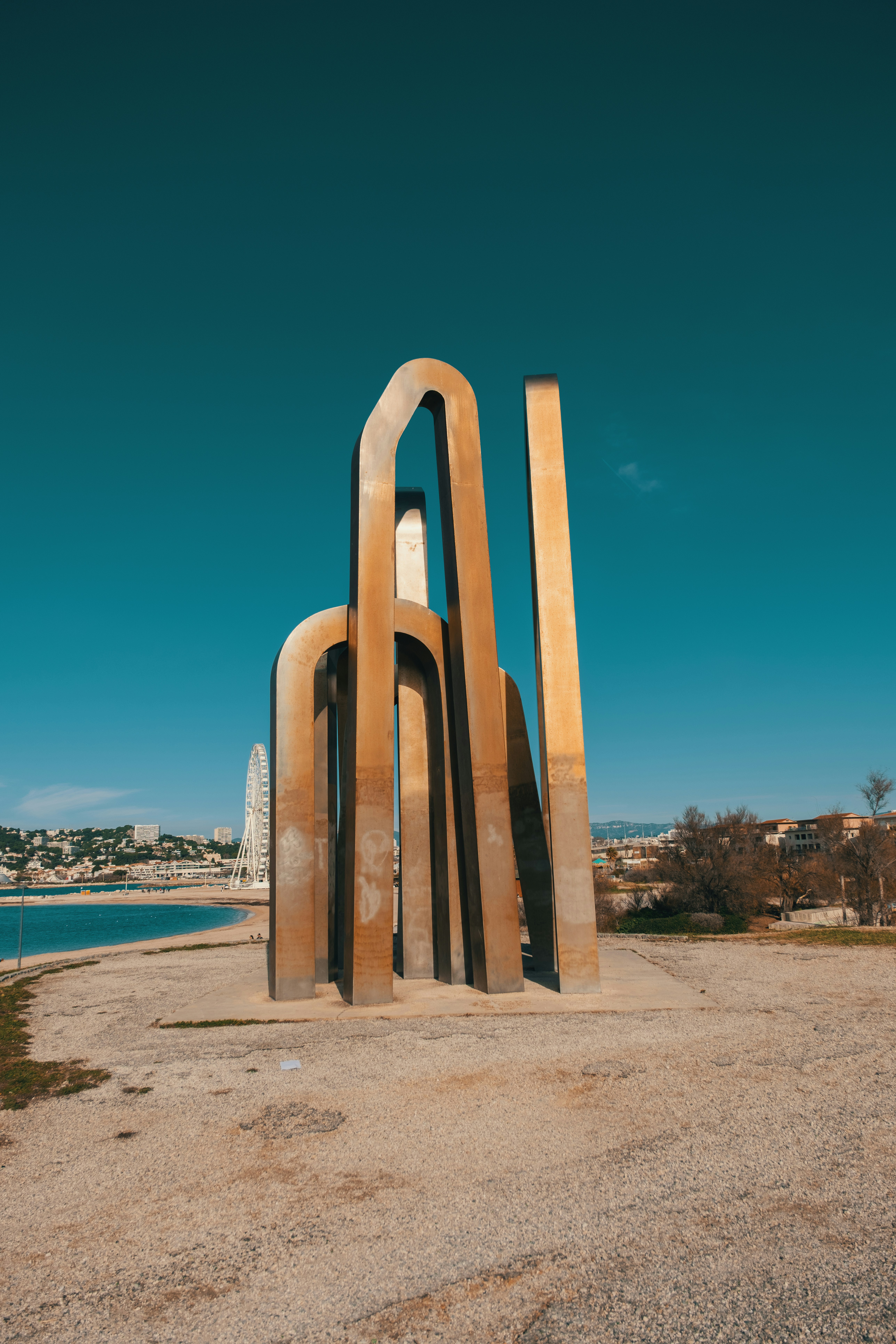 Rust Arches by the Sea: Steel Loops Confront the Horizon