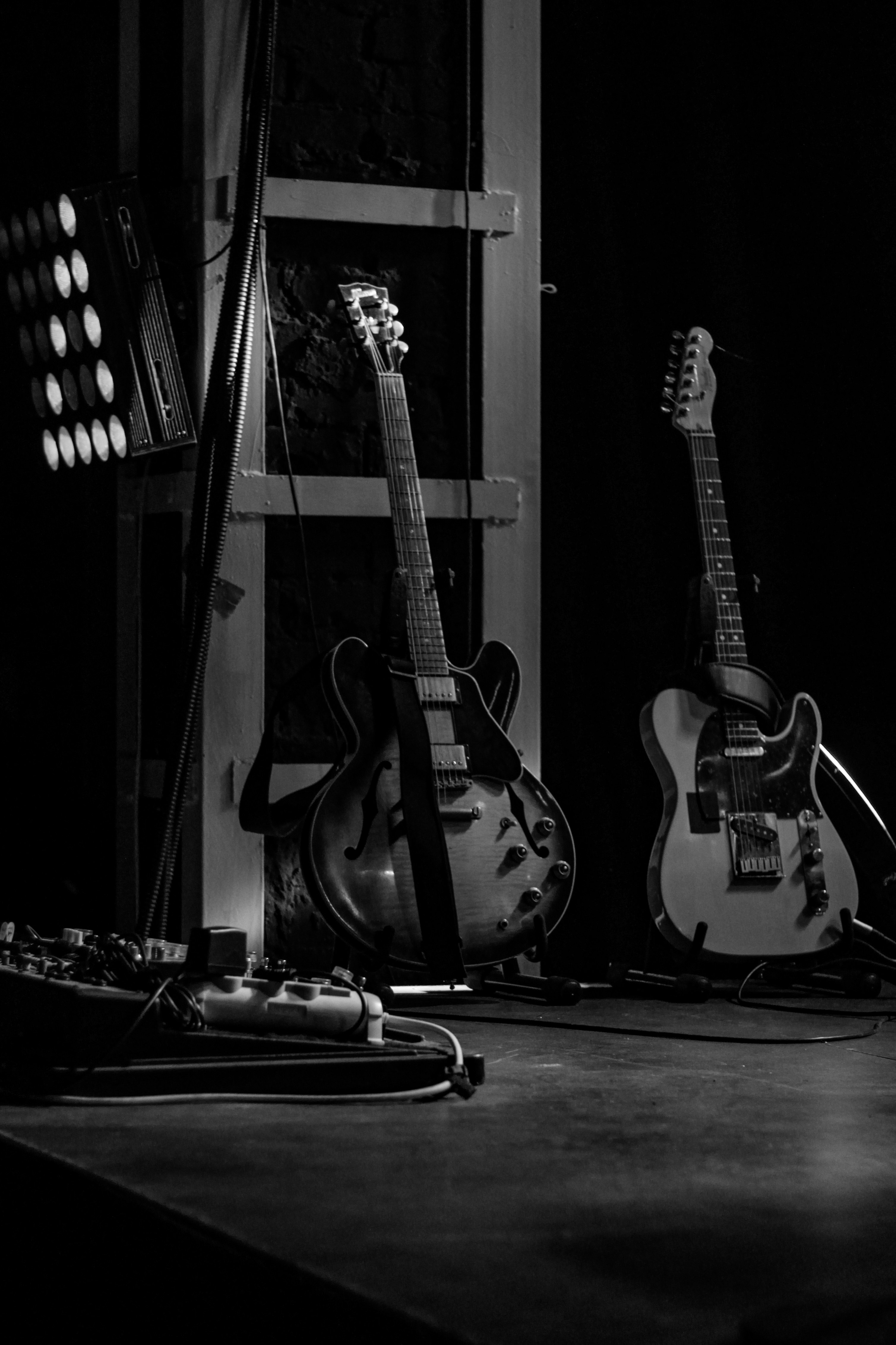 Shadows and Strings: A Quiet Backstage Moment with Twin Guitars