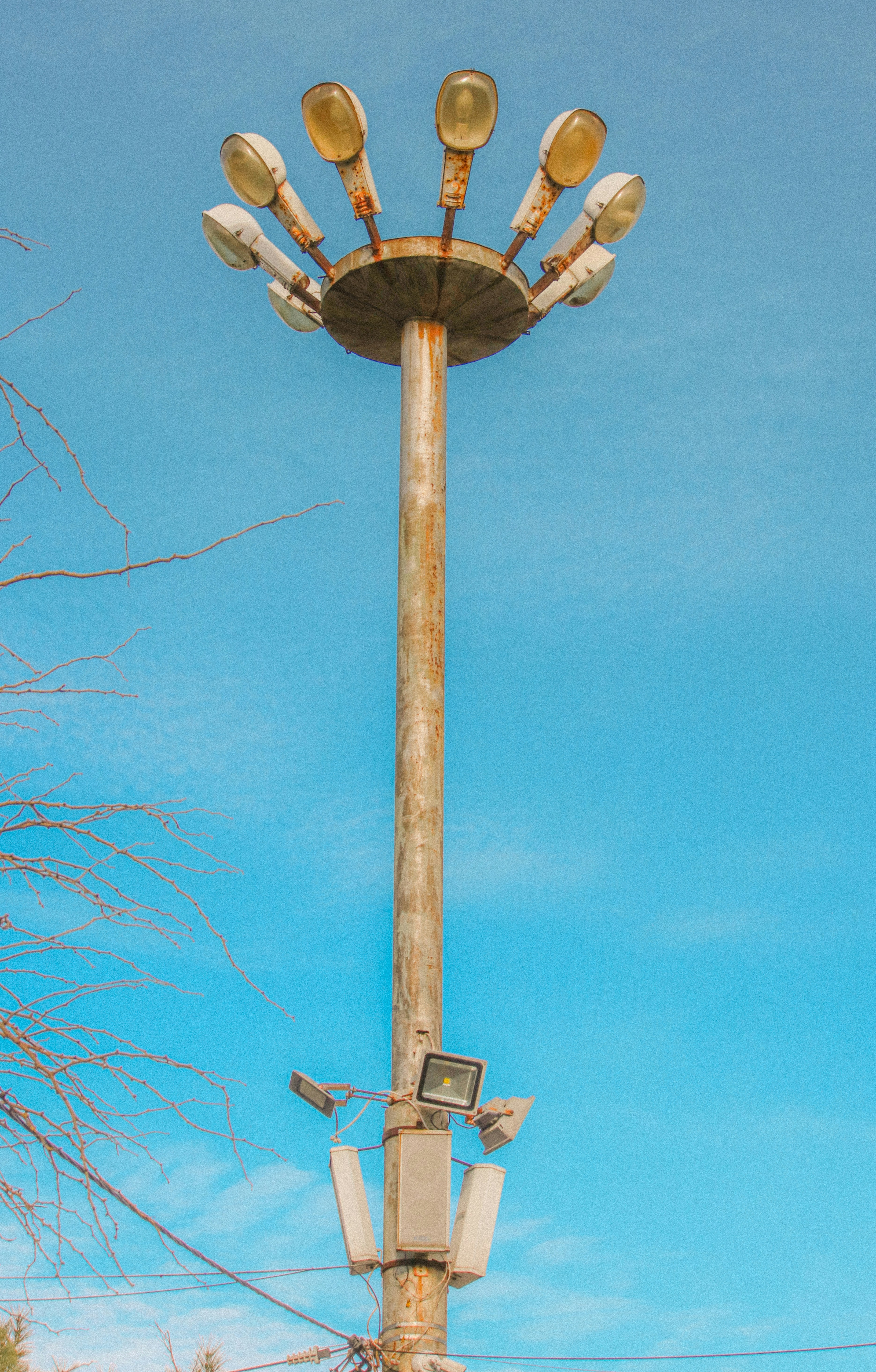 Ceremonial Crown of Lamps Rising Against a Clear Blue Sky